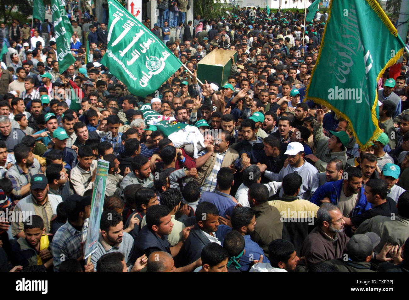Palestinian mourners carry the body of the newly appointed leader of ...