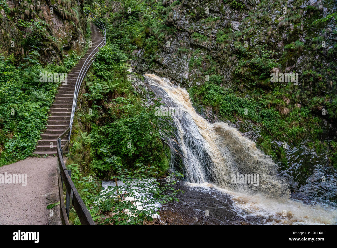 waterfall with bridge at Allerheiligen waterfall cascade in black ...