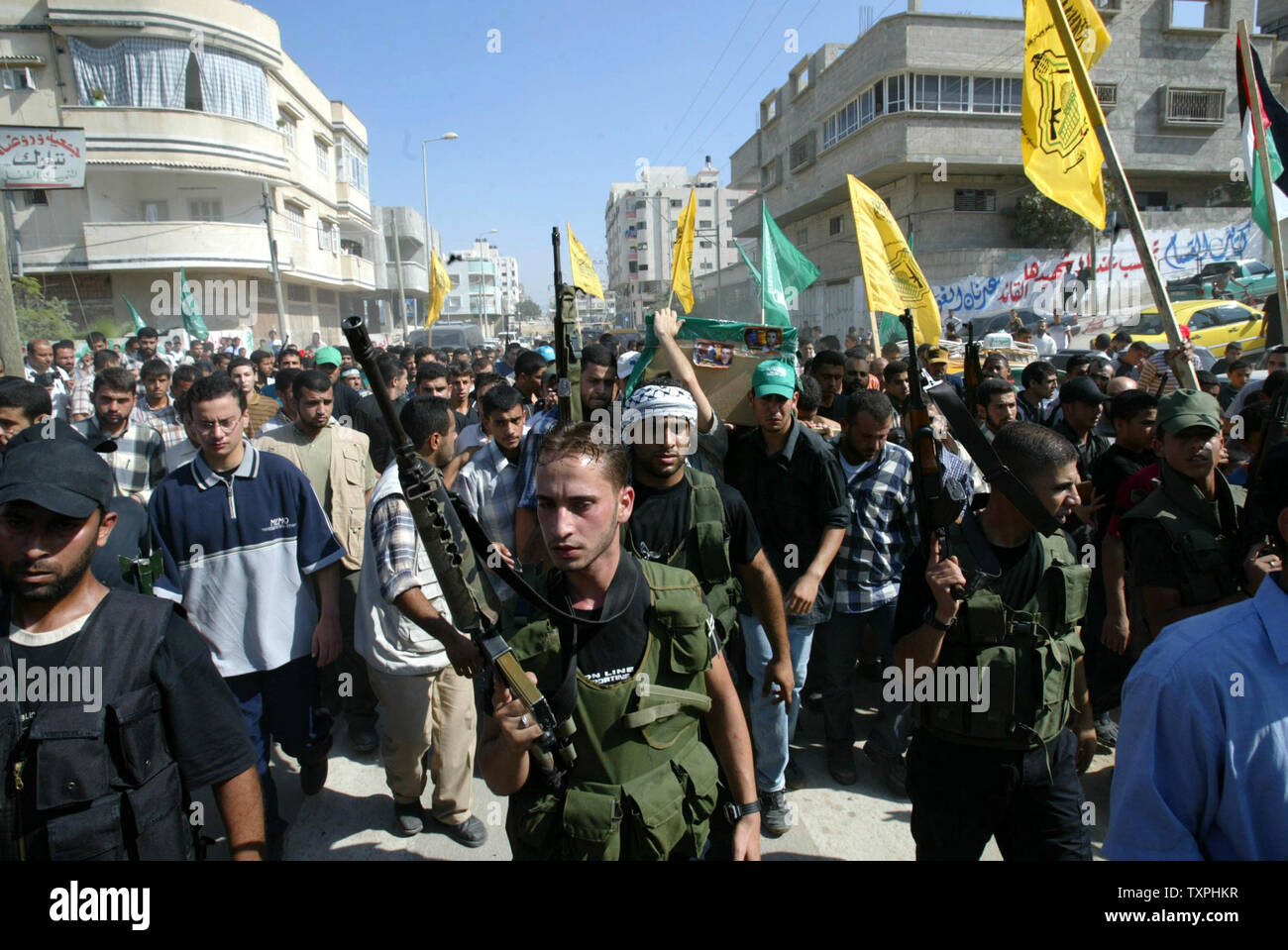 Members of the Palestinian Hamas movement carry the coffin of Adnan al ...