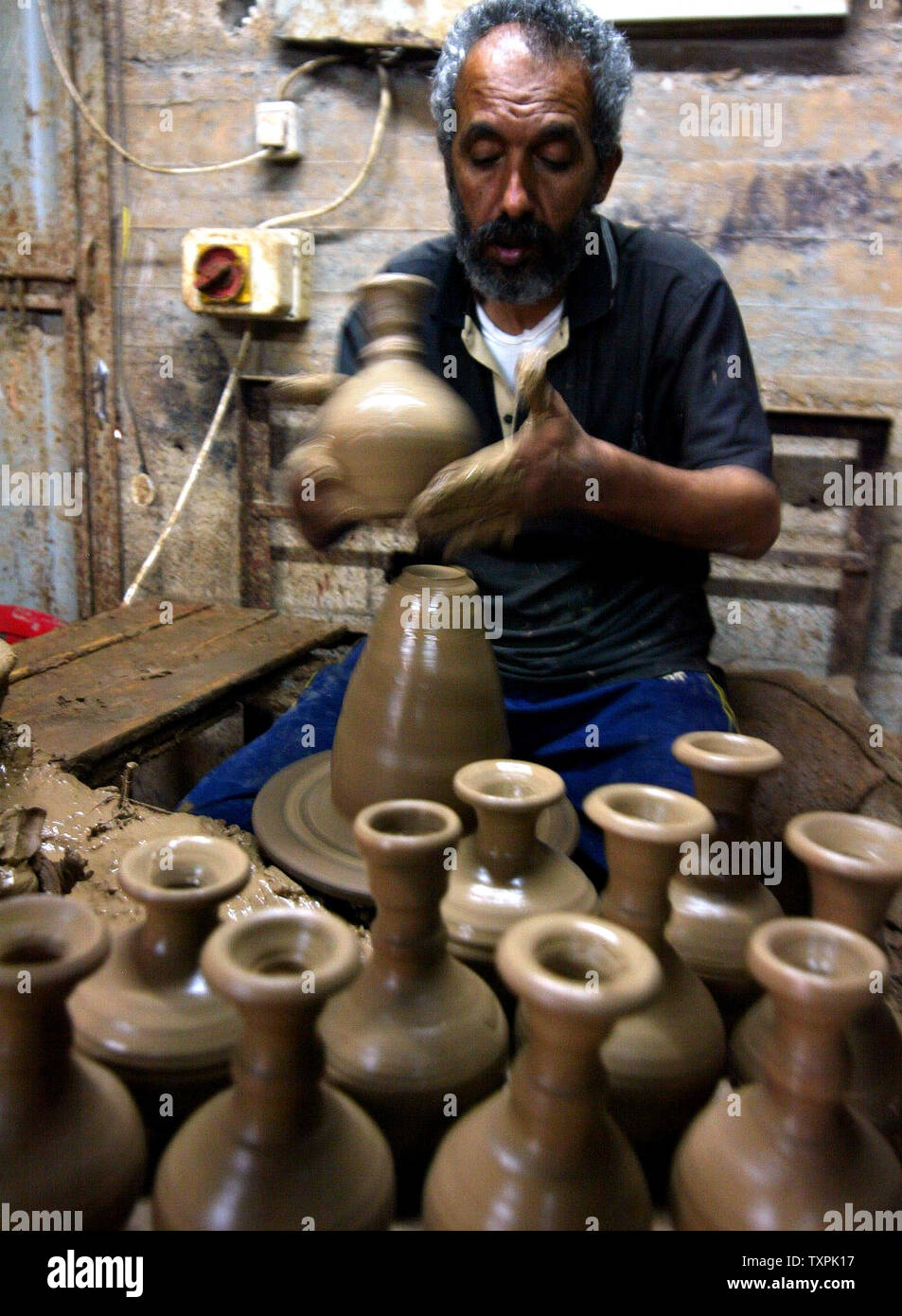 A Palestinian pottery maker Mahmod Atalah,47, works in his pottery ...
