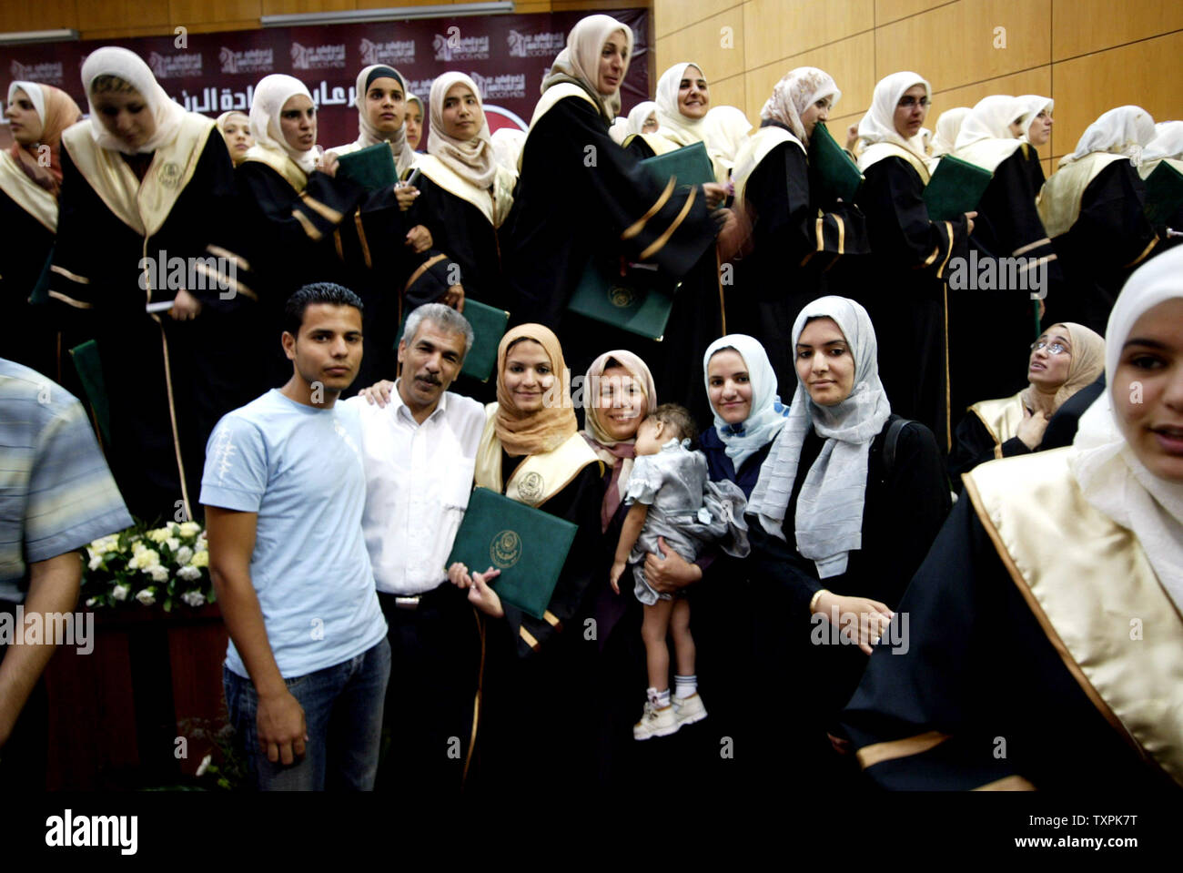 The families of Palestinian students of the Islamic University, attend ...