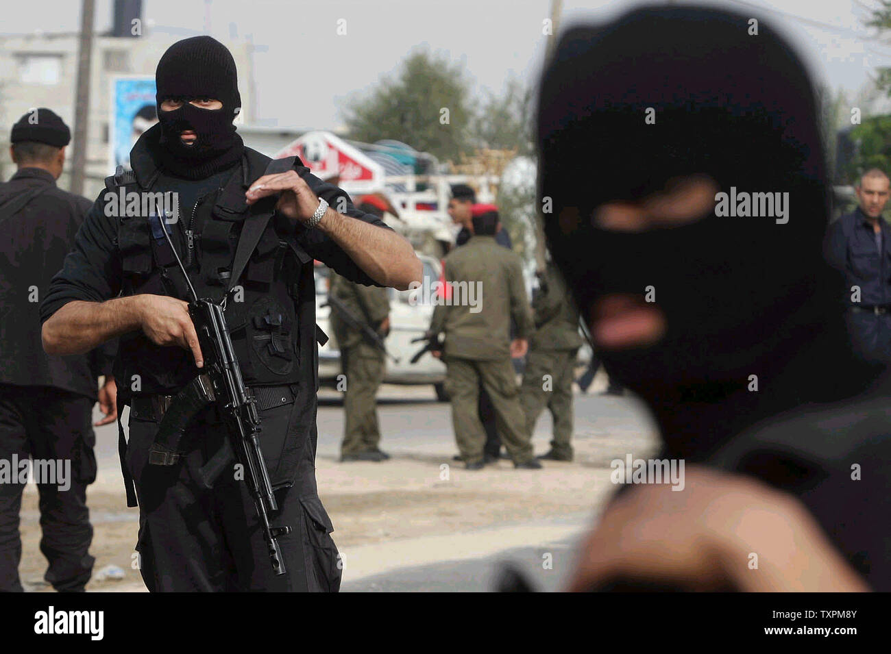 Palestinian police patrol a street as they search for stolen cars and ...