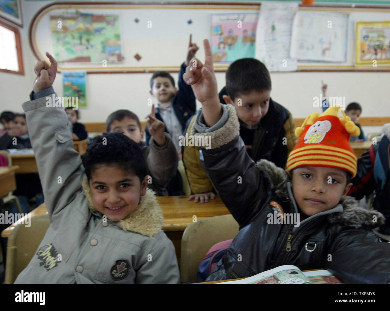 Palestinian school boys attend lessons at the Dar Al-Arqam of Hamas ...