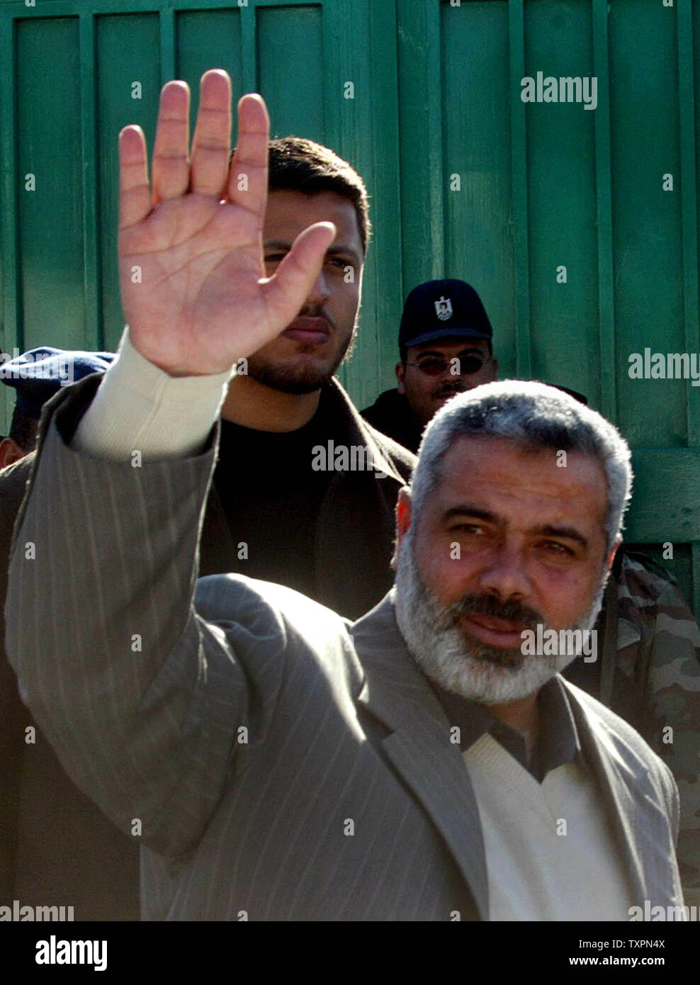 Palestinian Hamas leader Ismail Haniyeh waves after speaking to the ...