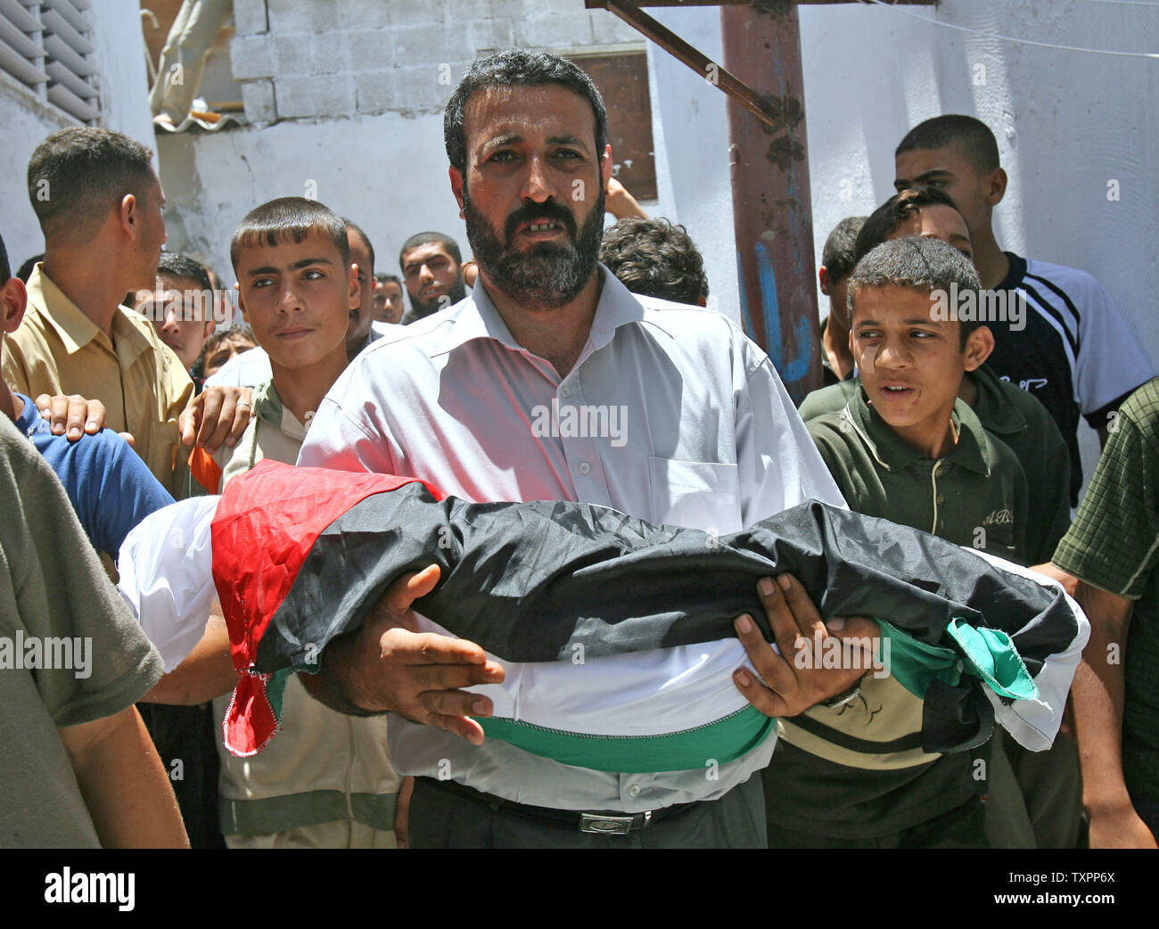 Khaled Wahba carried by his father during his funeral after Khaled was ...