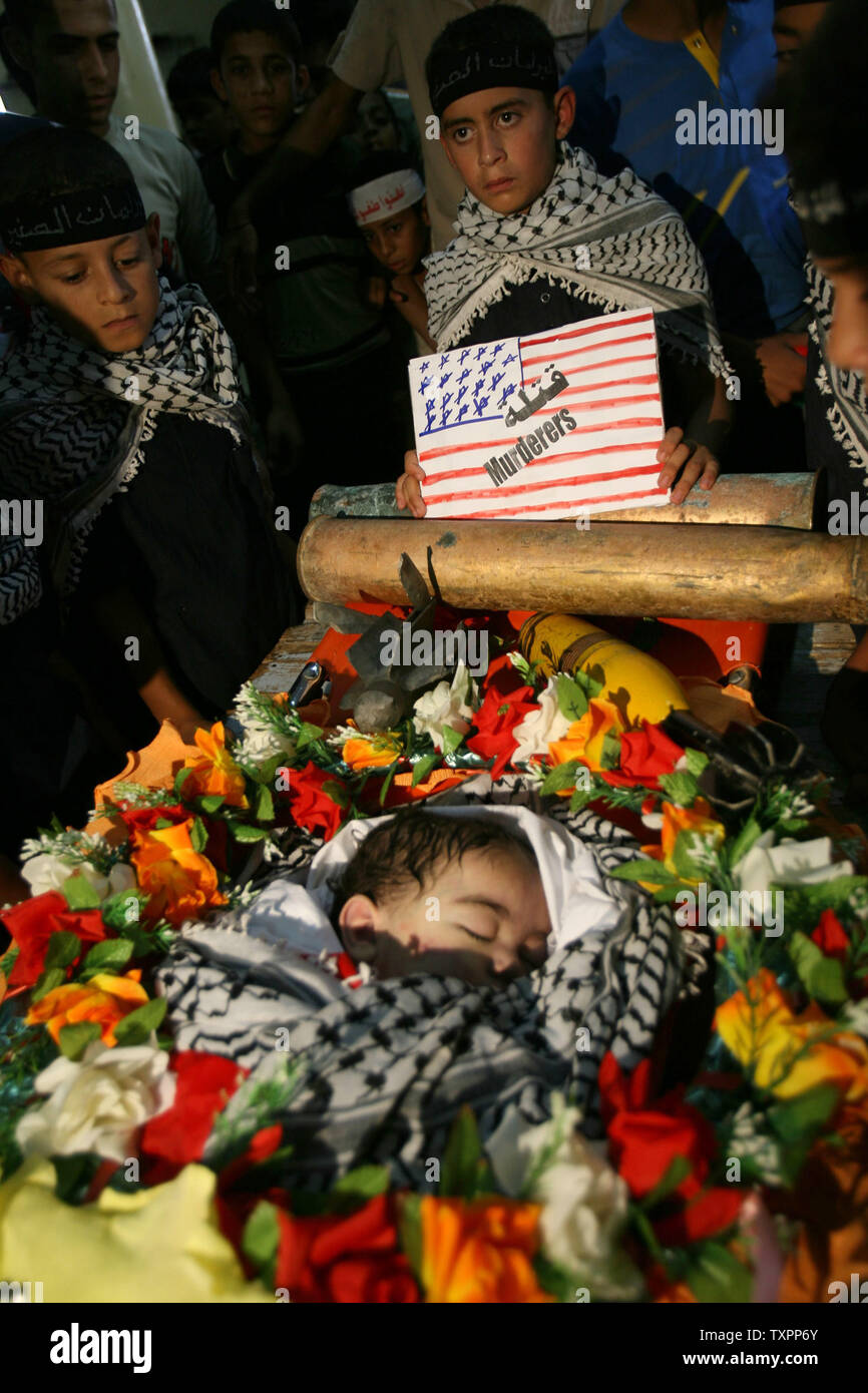 Palestinian children view Khaled Wahba, killed during an Israeli ...