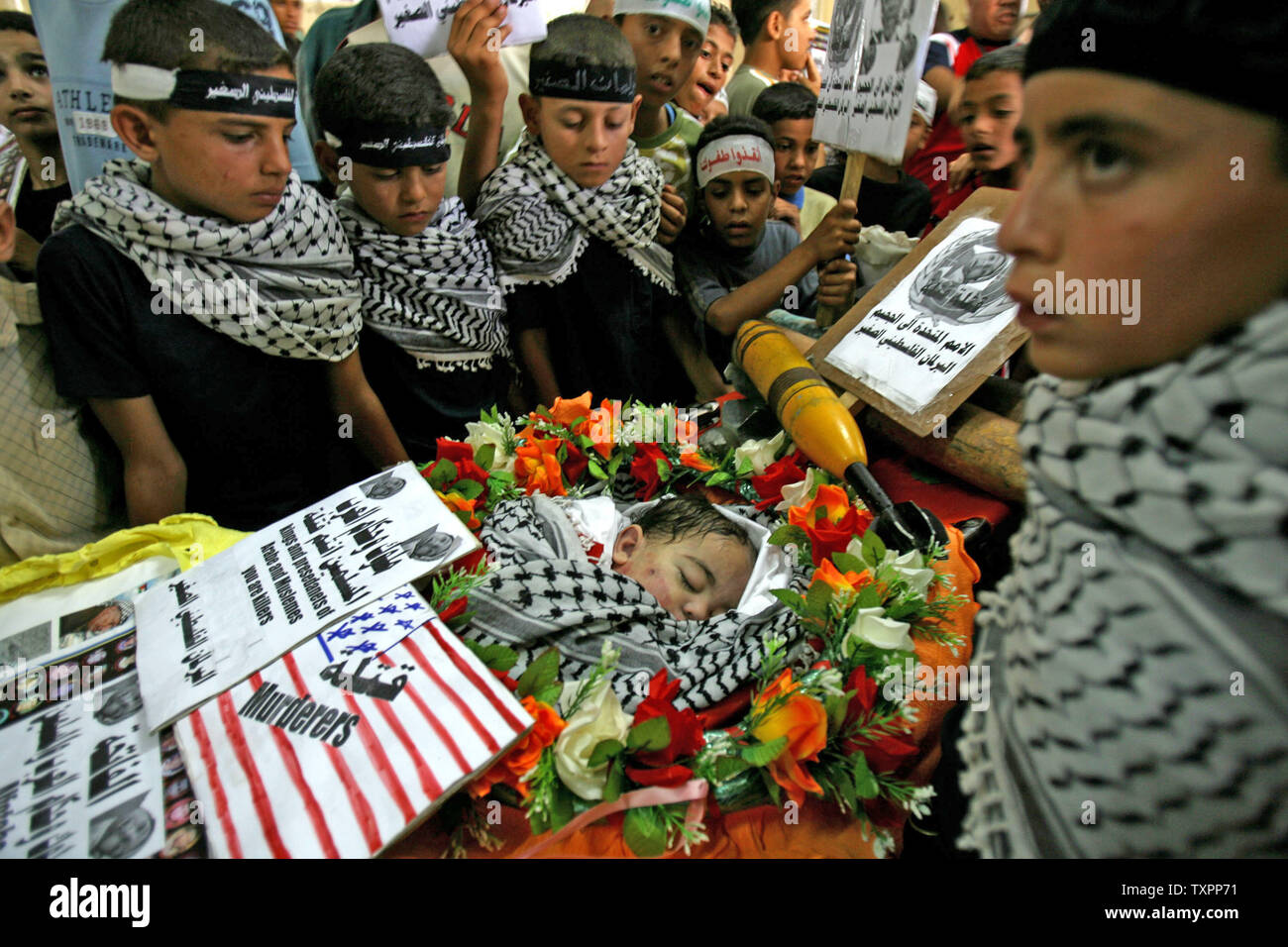 Palestinian children view Khaled Wahba, killed during an Israeli ...