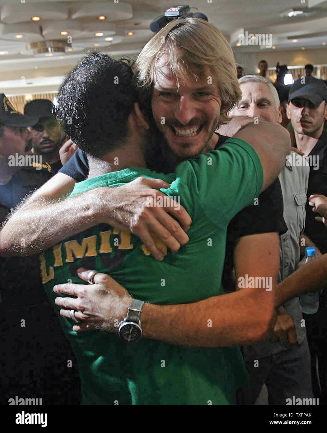 Fox News journalists Olaf Wiig, 36, from New Zealand and Steve Centanni are greeted at a hotel ...