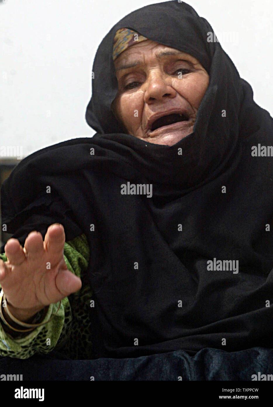 The mother of a 34-year-old Palestinian woman cries during her funeral ...