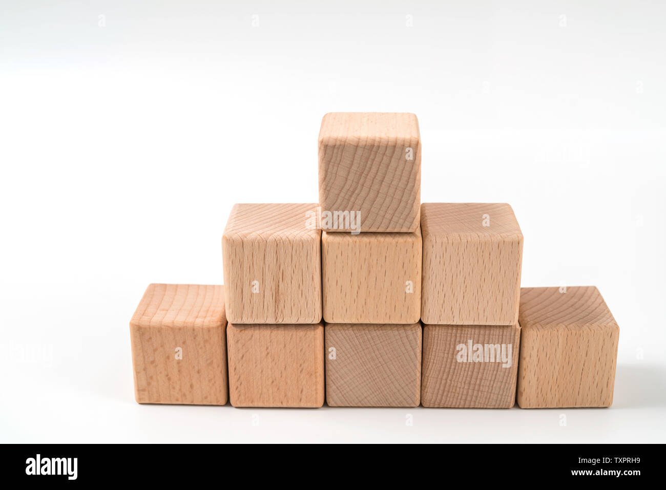 wood cube arrange in pyramid shape ,business concept Stock Photo - Alamy