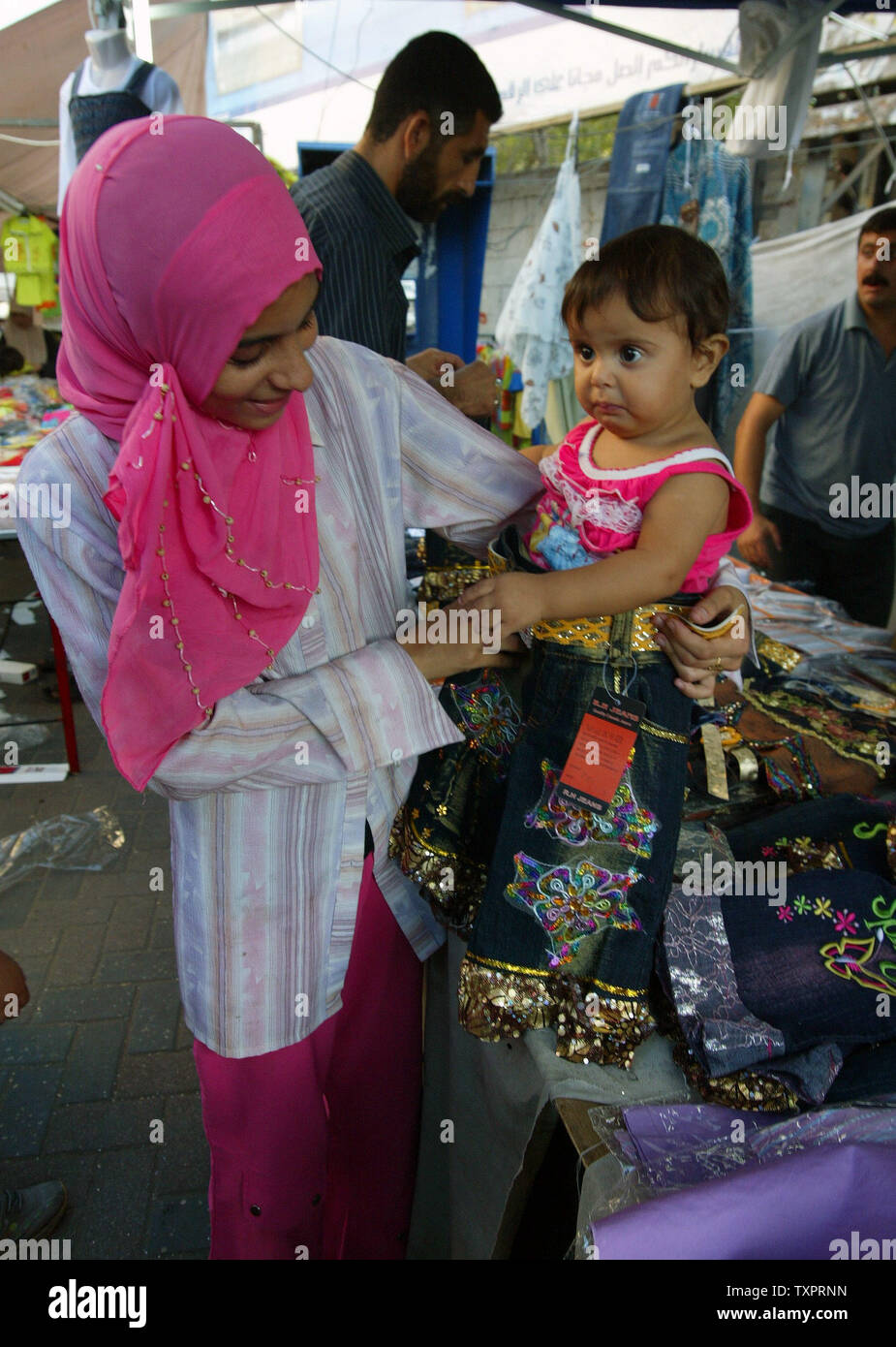 Palestinians shop in the popular Firas market in Gaza on October 11 ...