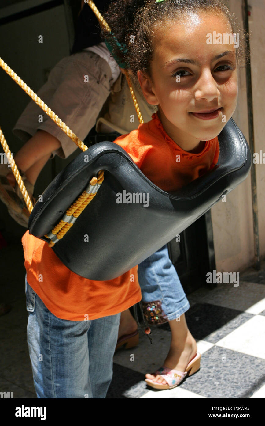 A Palestinian girl, nine-year-old Aya Wael Masoud, who was born without ...