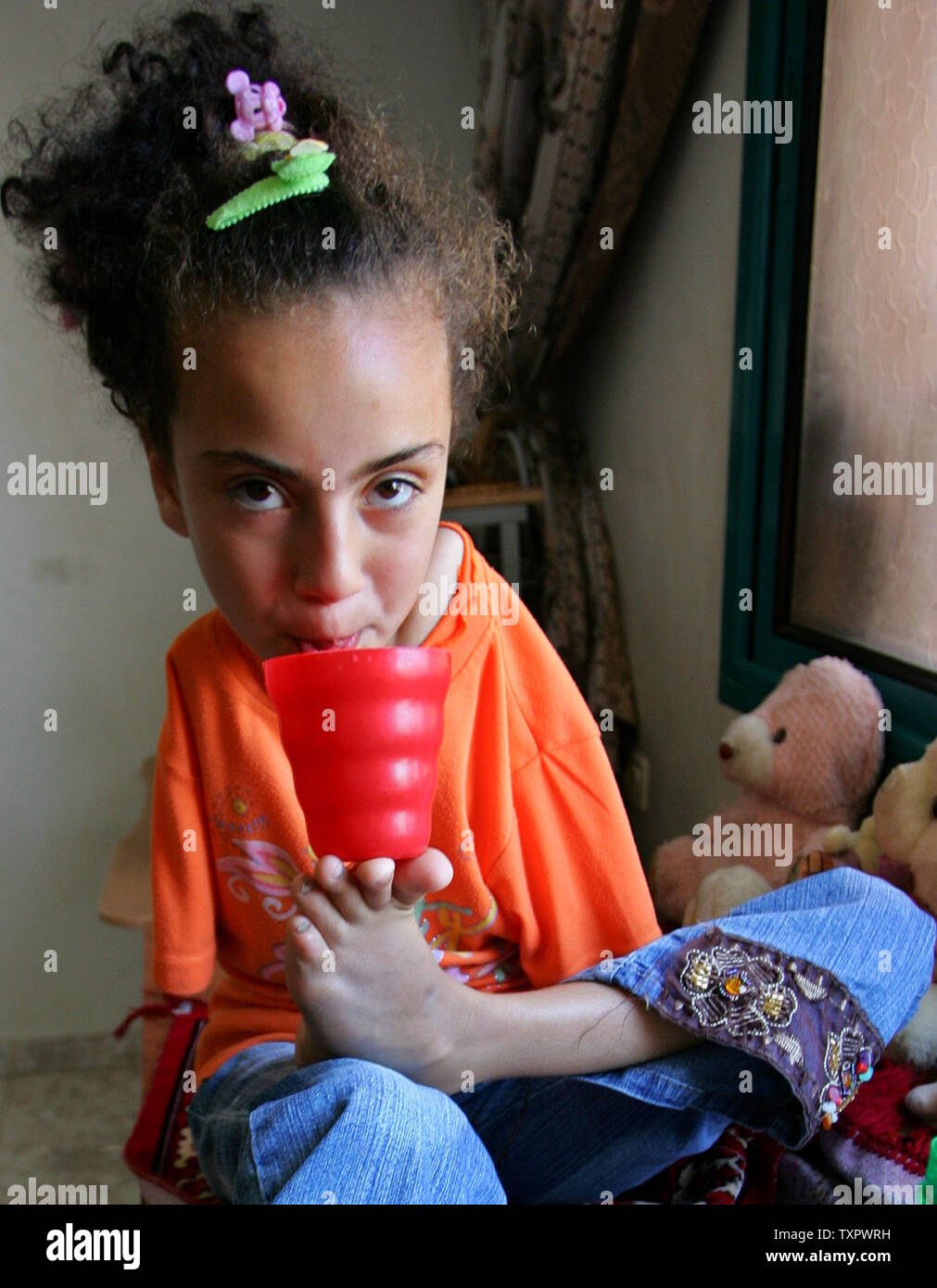 A Palestinian girl, nine-year-old Aya Wael Masoud, who was born without ...