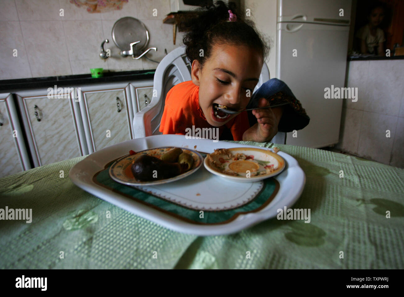 A Palestinian girl, nine-year-old Aya Wael Masoud, who was born without ...
