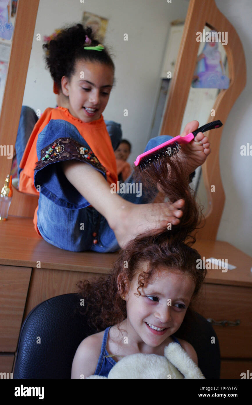 A Palestinian girl, nine-year-old Aya Wael Masoud, who was born without ...