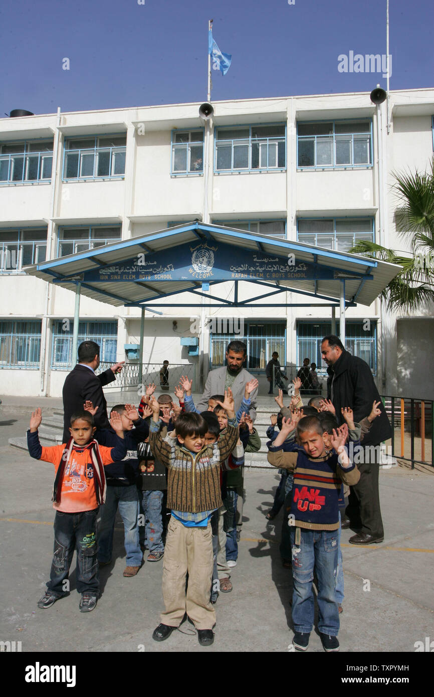 Palestinian school children line up after recess at the UNRWA's (UN ...