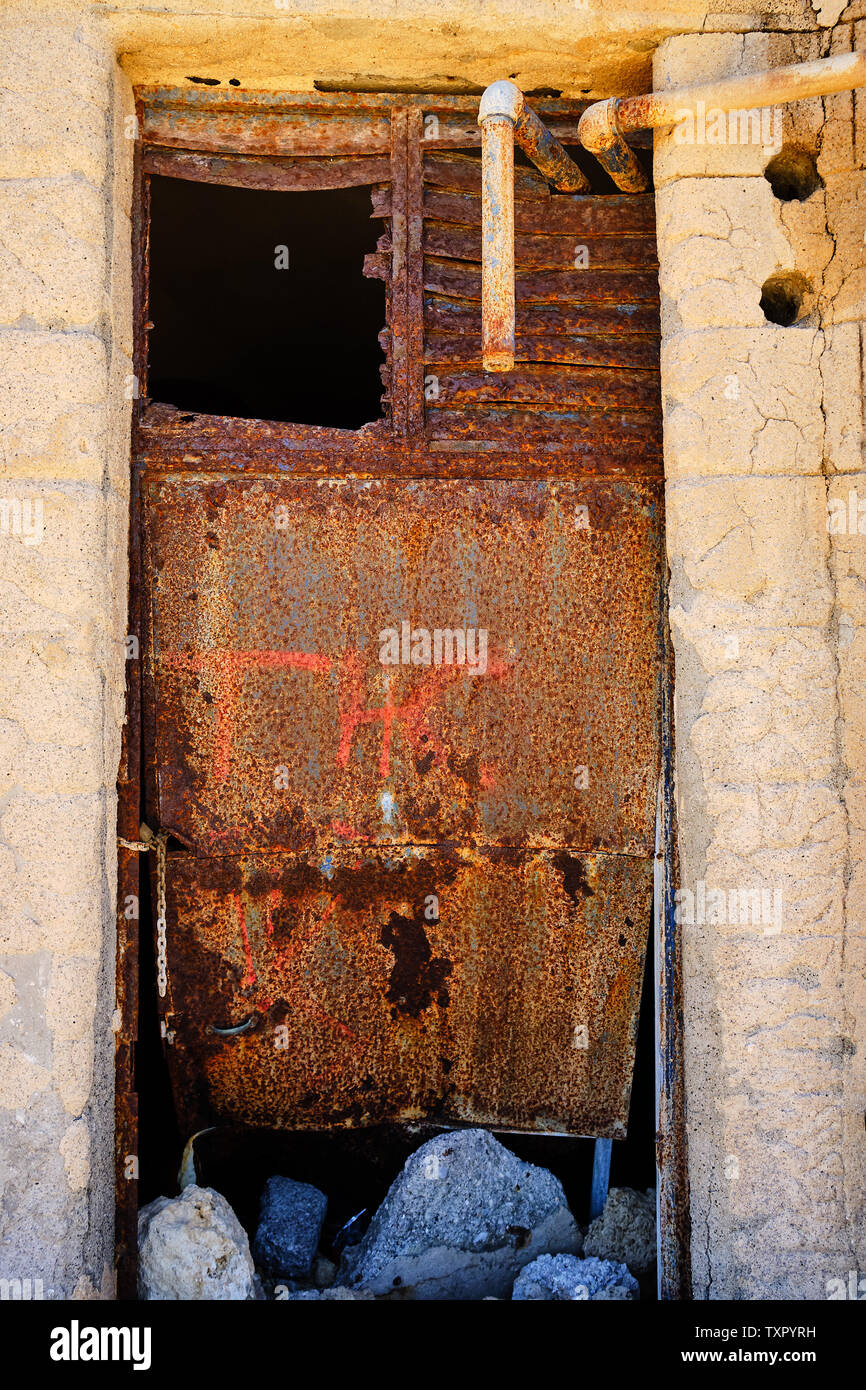 rusty old door with concrete facade Stock Photo - Alamy