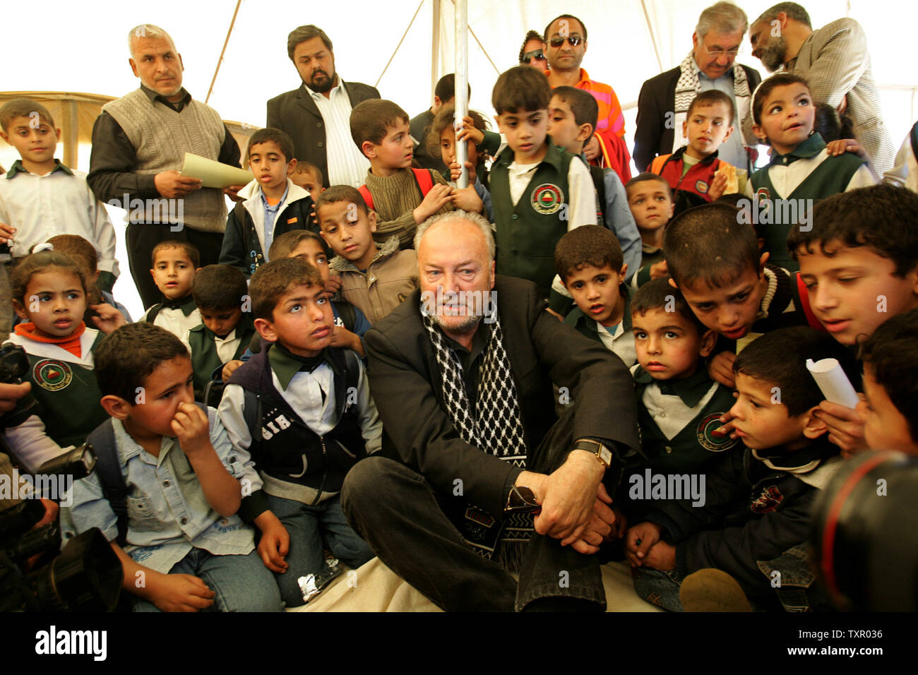 British lawmaker and activist George Galloway sits among Palestinian ...