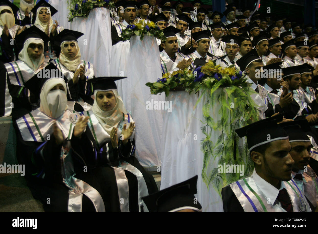 Palestinian students attend the graduation ceremony at University ...
