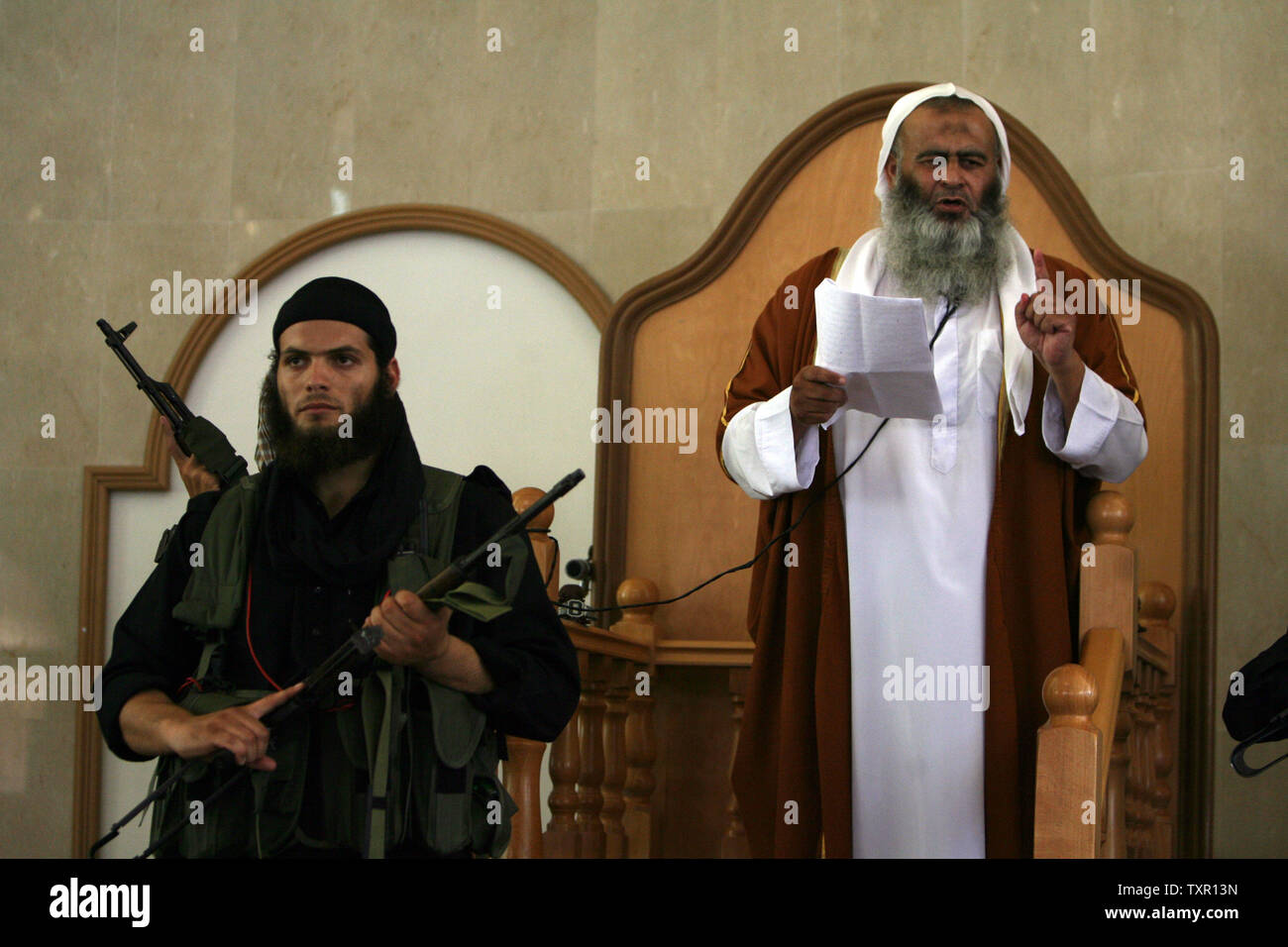 Members of a group called Jund Ansar Allah surround their leader Abdel ...