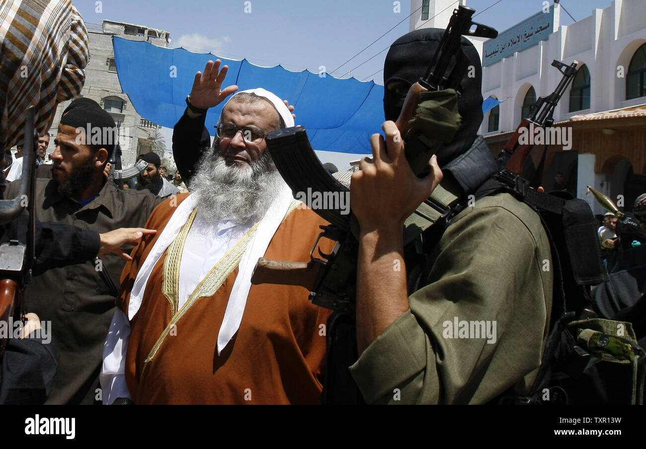 Members of a group called Jund Ansar Allah surround their leader Abdel ...