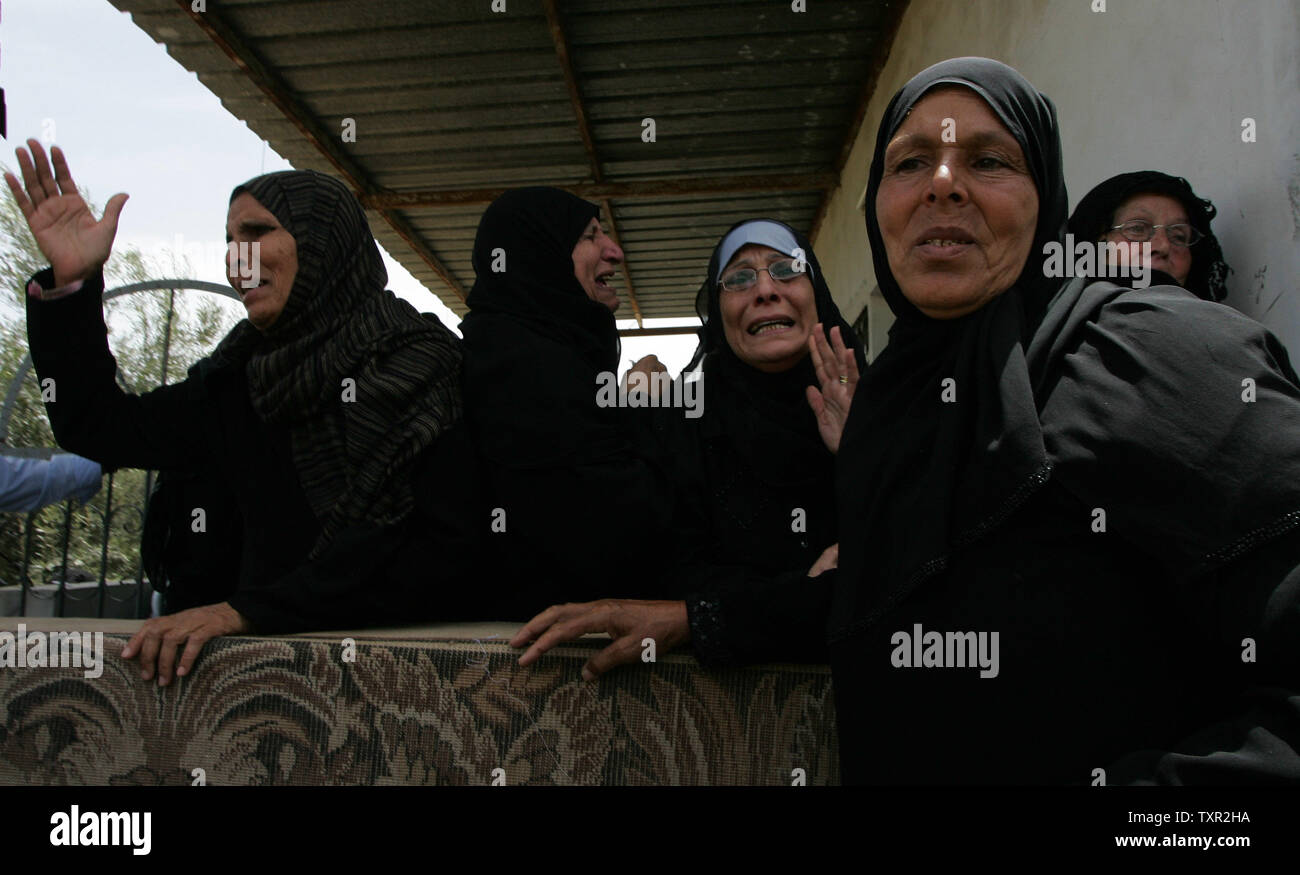 Palestinians mourn Nader Abo Daqa, 17, during his funeral in Khan Yunis ...