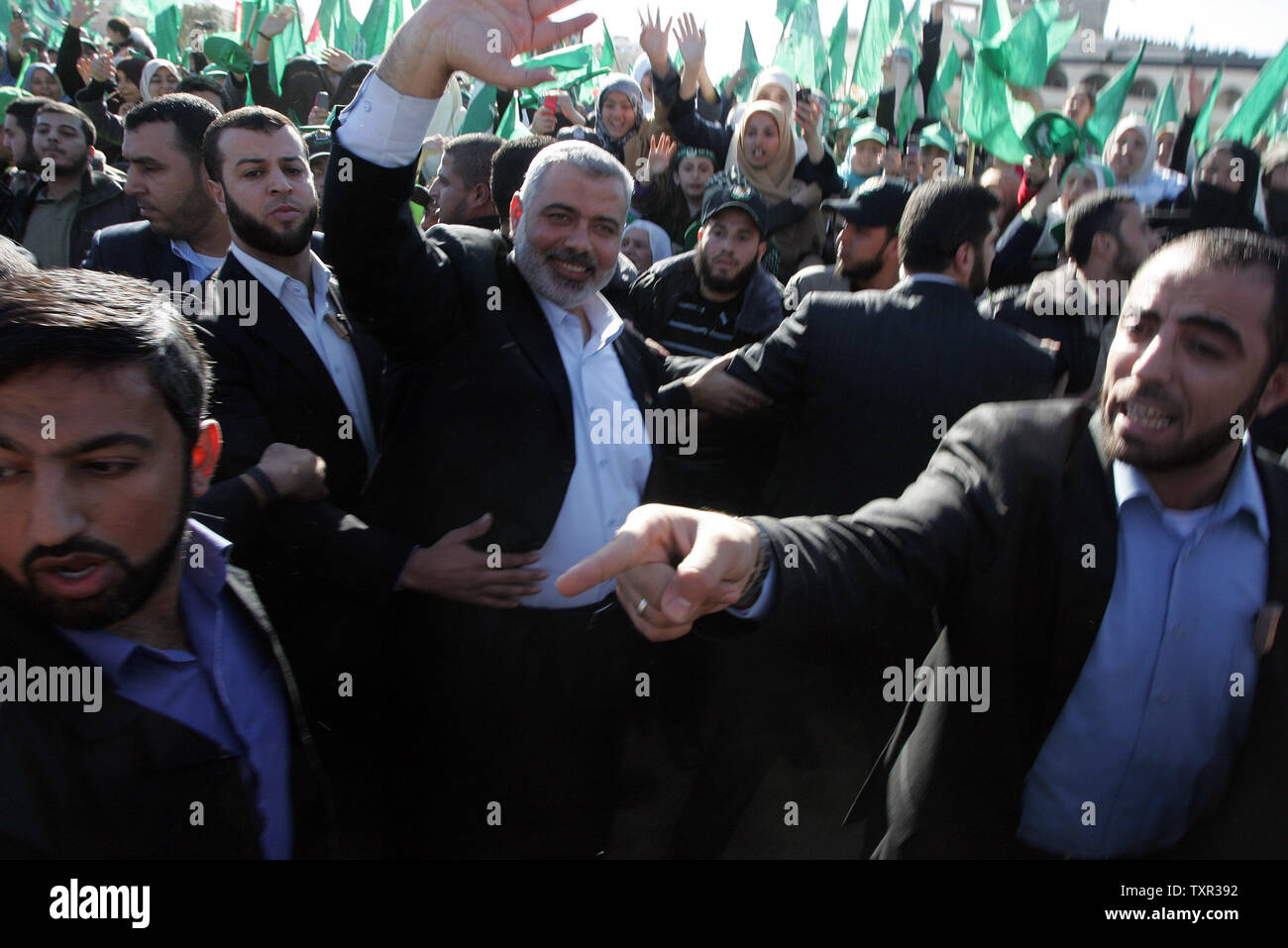Ismail Haniya, head of the Hamas government, waves to tens of thousands ...