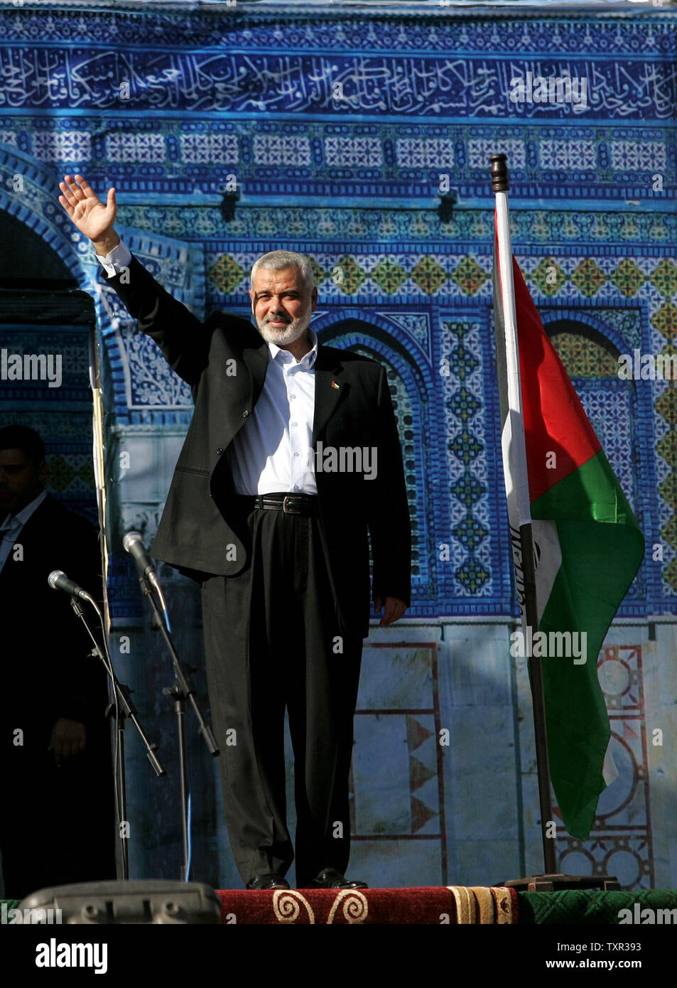 Ismail Haniya, head of the Hamas government, waves to tens of thousands ...