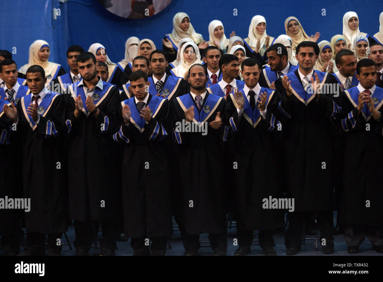 Palestinian students attend the graduation ceremony at Islamic ...