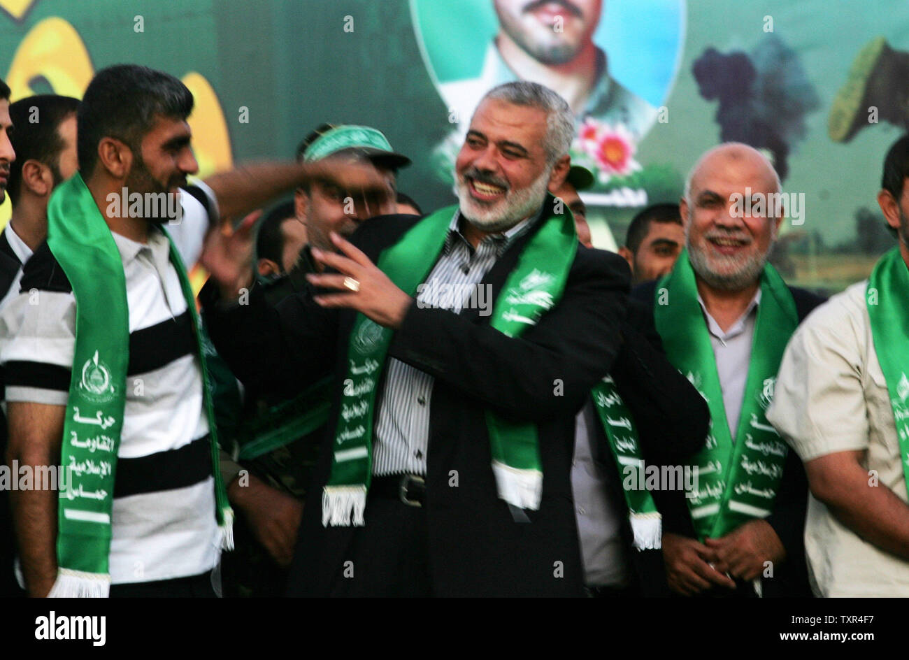 Hamas leader Ismail Haniyah (c) attends a ceremony celebrating the ...