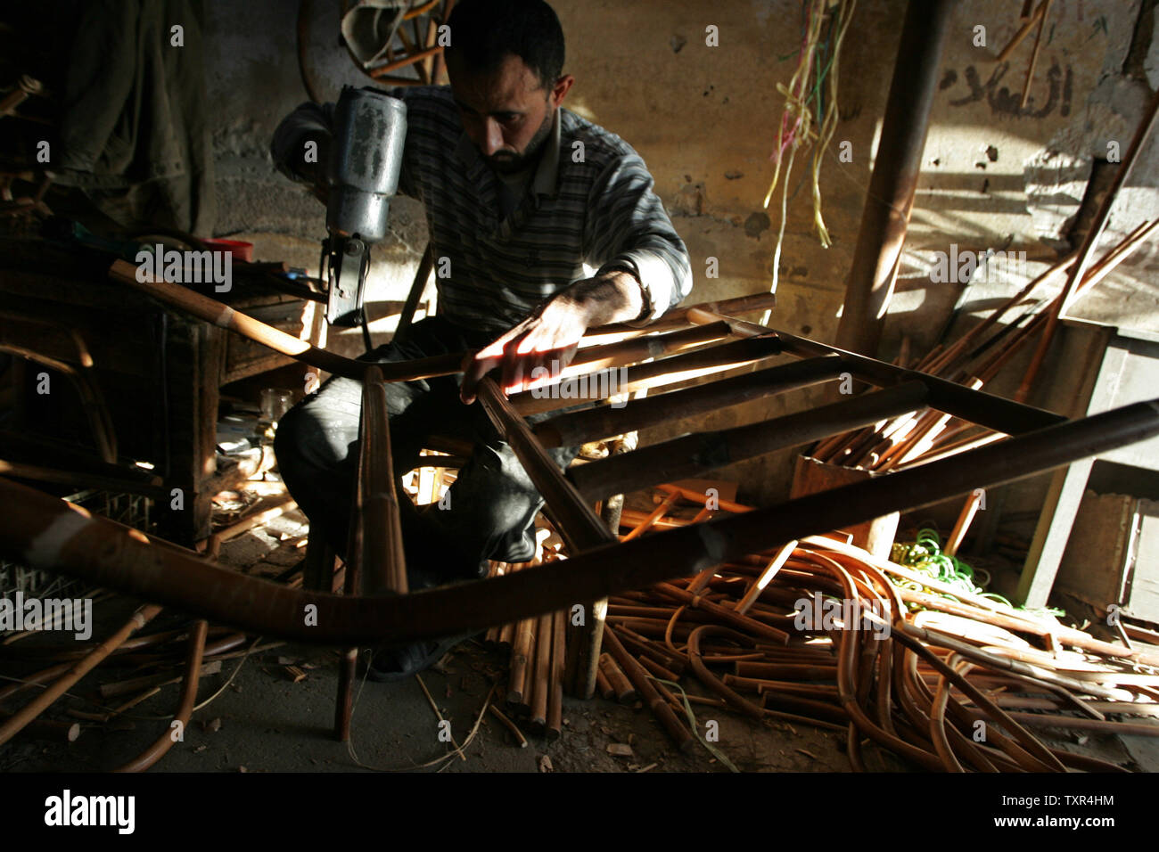 Palestinian Bamboo maker Yahya Almdlom, 35, works in his Bamboo factory ...