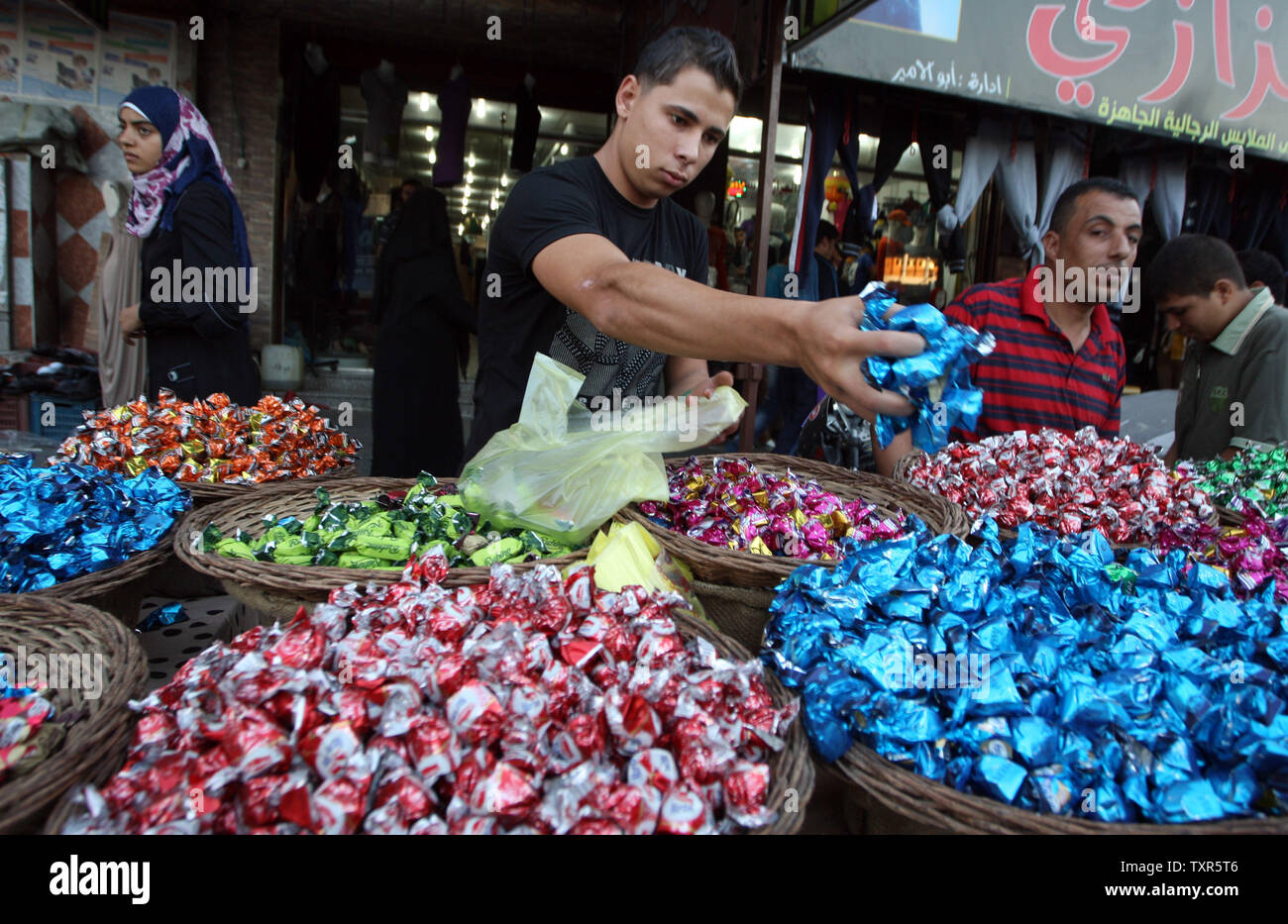 A Palestinians buys sweets in Gaza City, on October 25, 2012, in ...