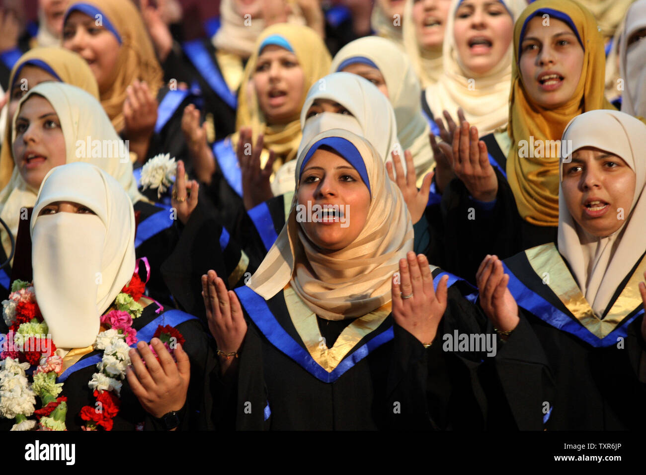 Palestinian students attend the graduation ceremony at Islamic ...