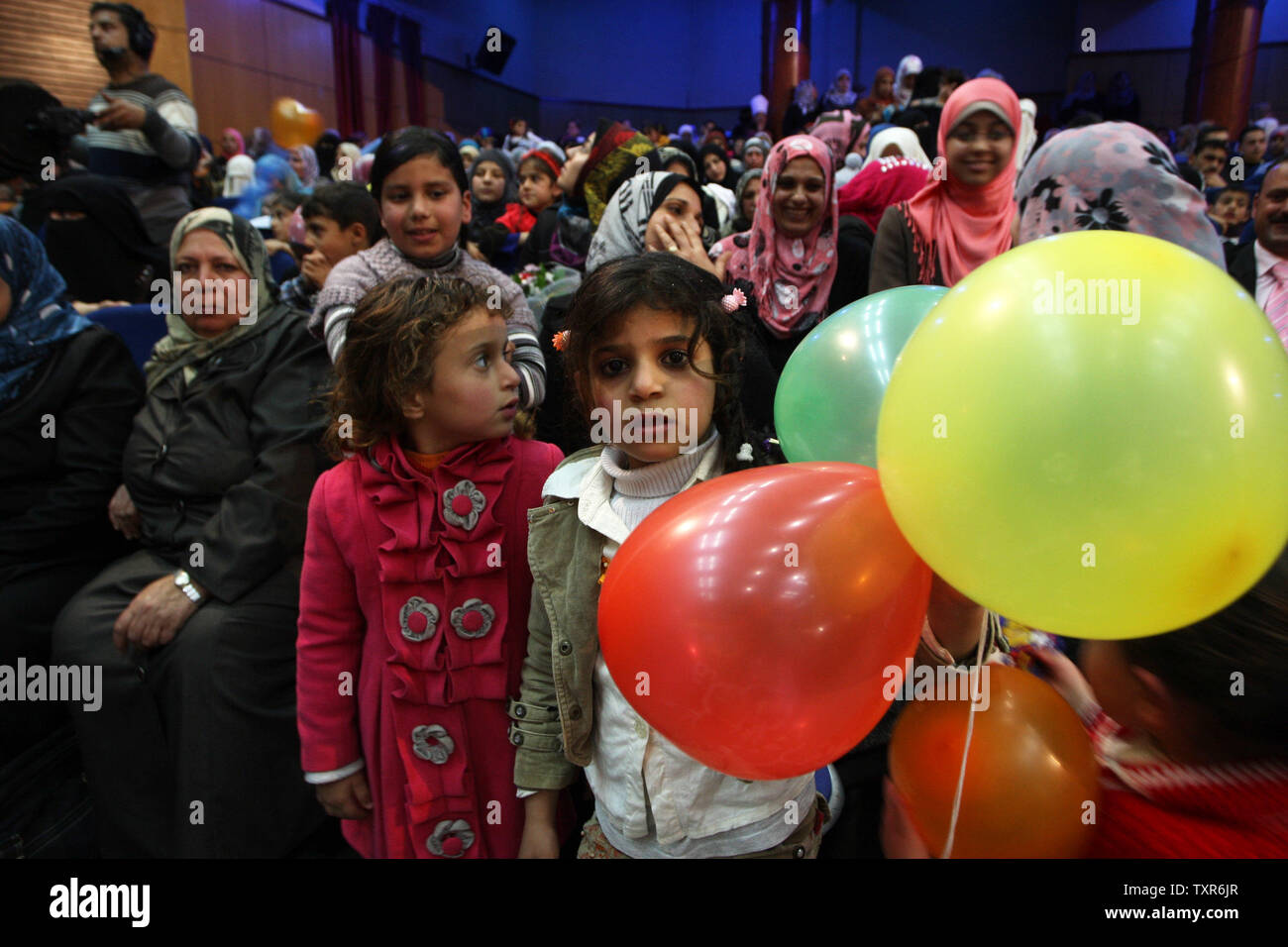 The families of Palestinian students of the Islamic University, attend ...