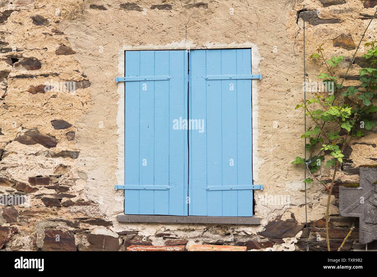 Isolated blue shutters of a window in the countryside (Moselkern ...
