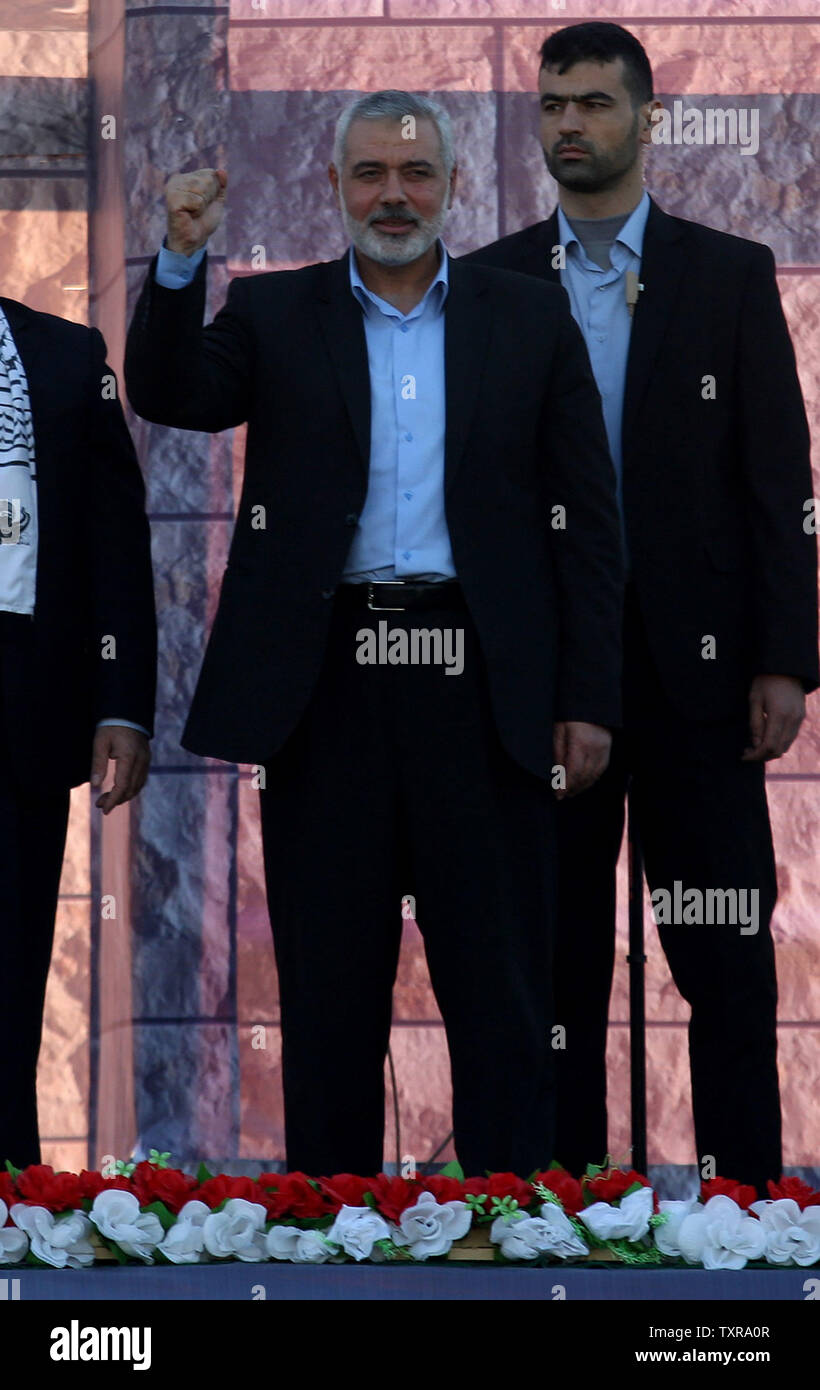 Senior Hamas leader Ismail Haniyeh (L) take part during a Hamas women's ...