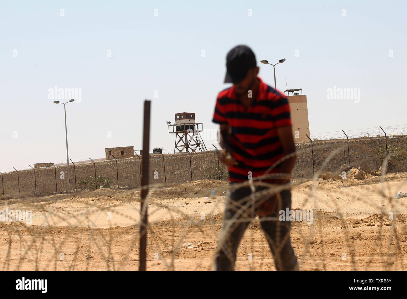 A member of the Palestinian security forces loyal to Hamas installs ...