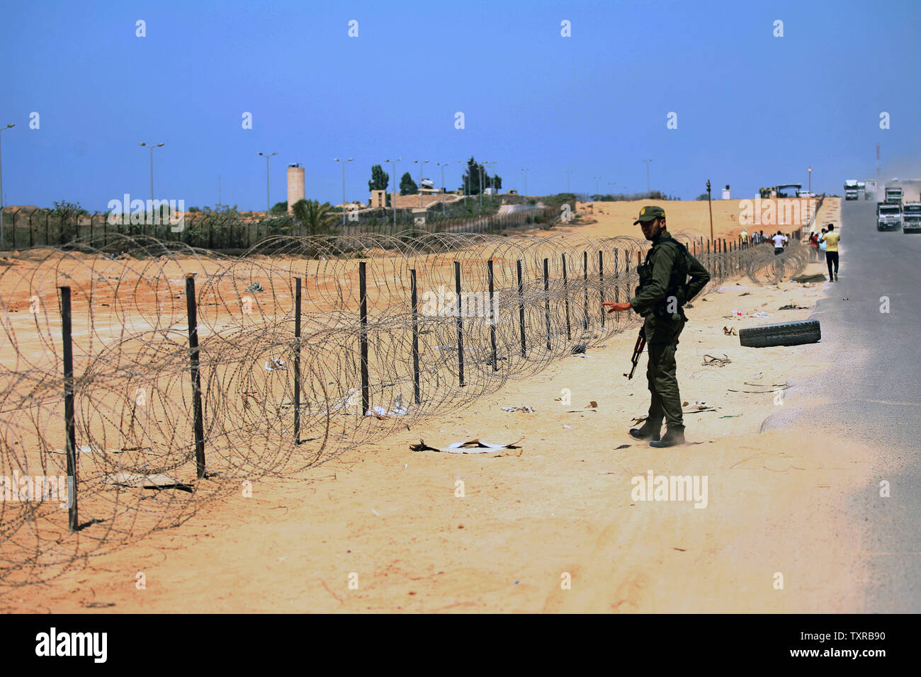 A member of the Palestinian security forces loyal to Hamas installs ...