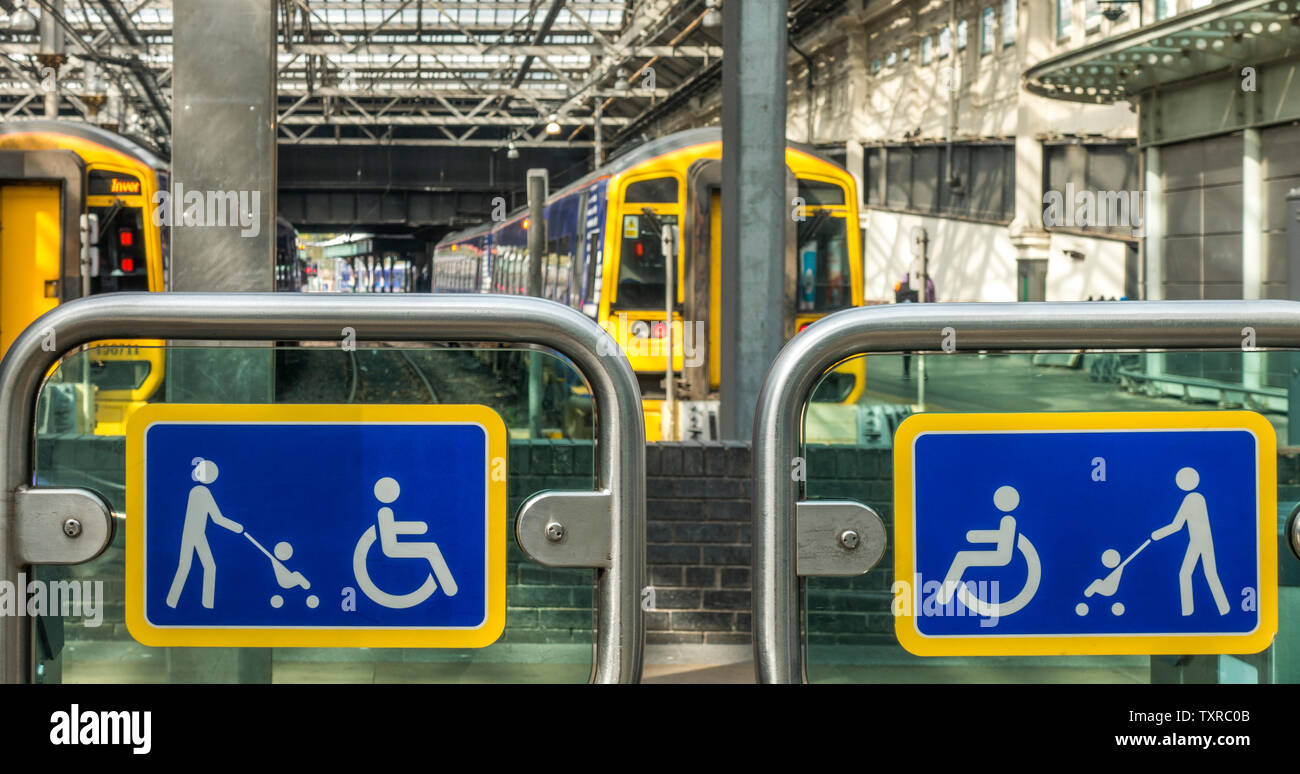 Metal barriers to train platforms, with sign restricting entry to ...