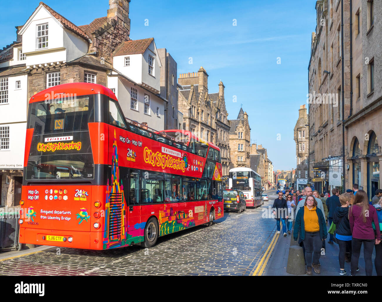 City sightseeing open top tour bus and a busy street scene on Canongate ...