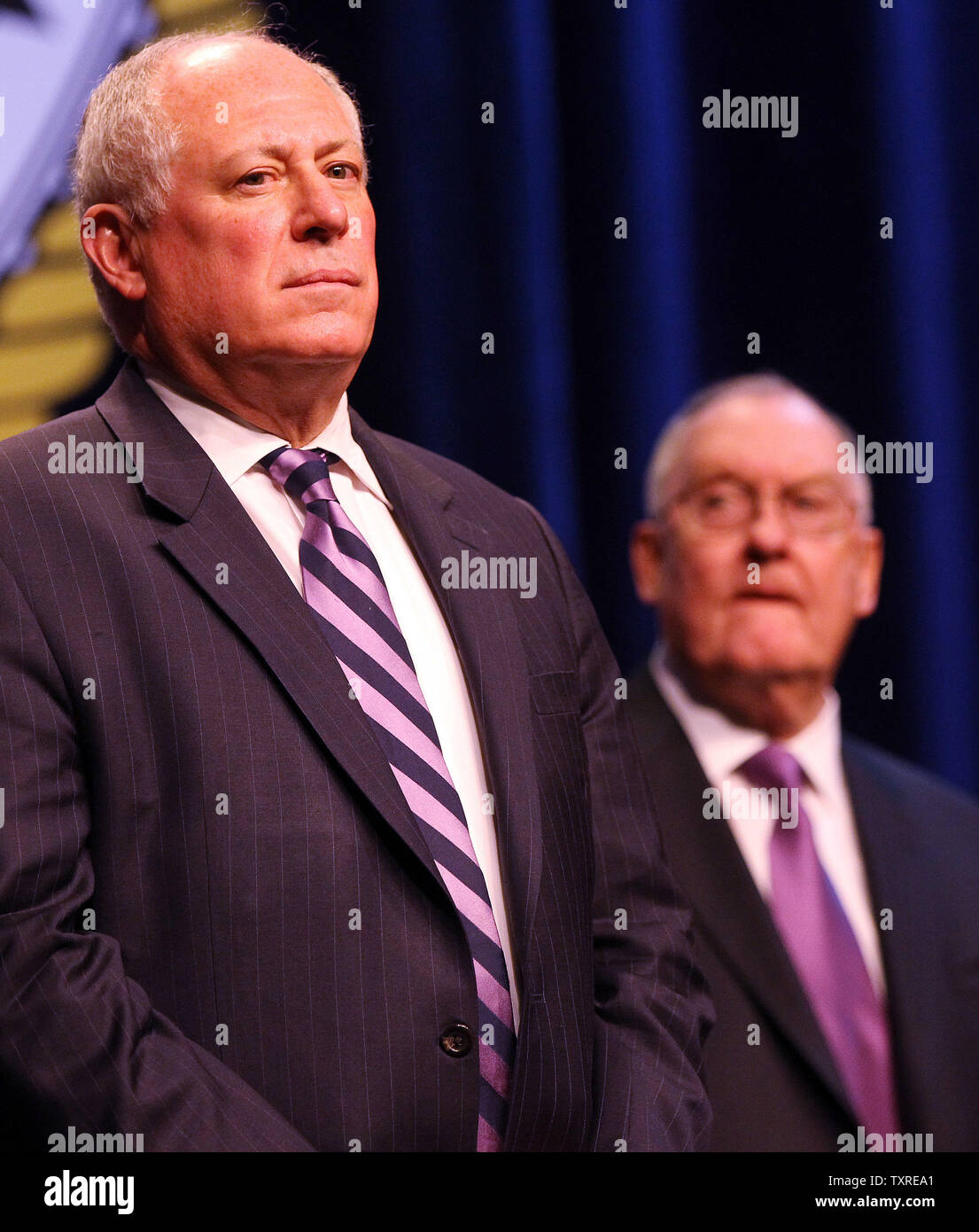 Illinois Governor Pat Quinn, Jr.(L) waits to take the oath of office as ...