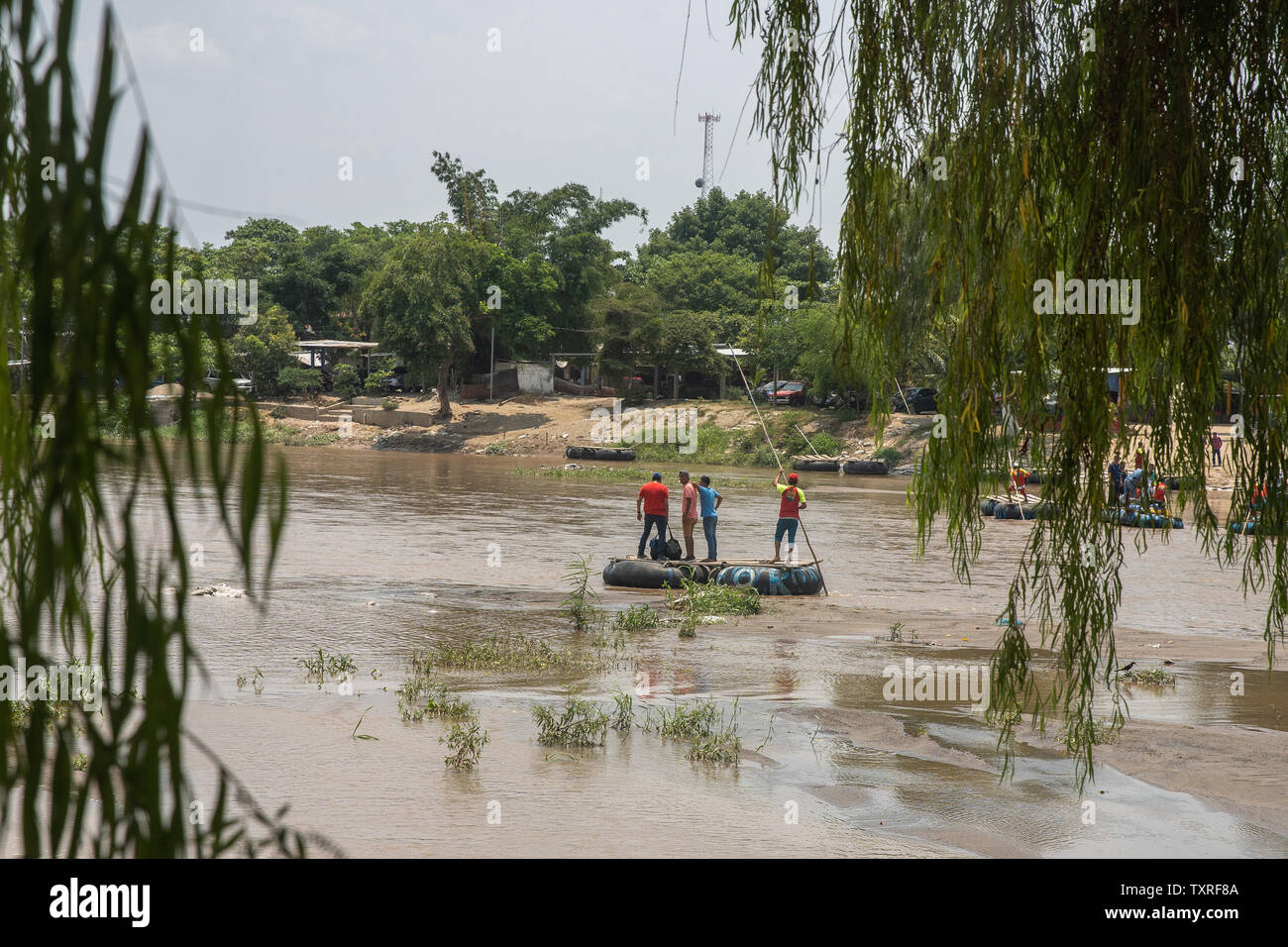 Rafts made out of inflatable tires ferry people across the Suchiate ...