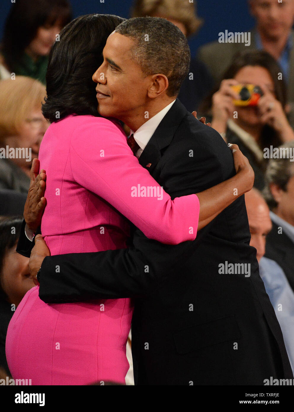 President Barack Obama hugs his wife First Lady Michelle Obama at the ...