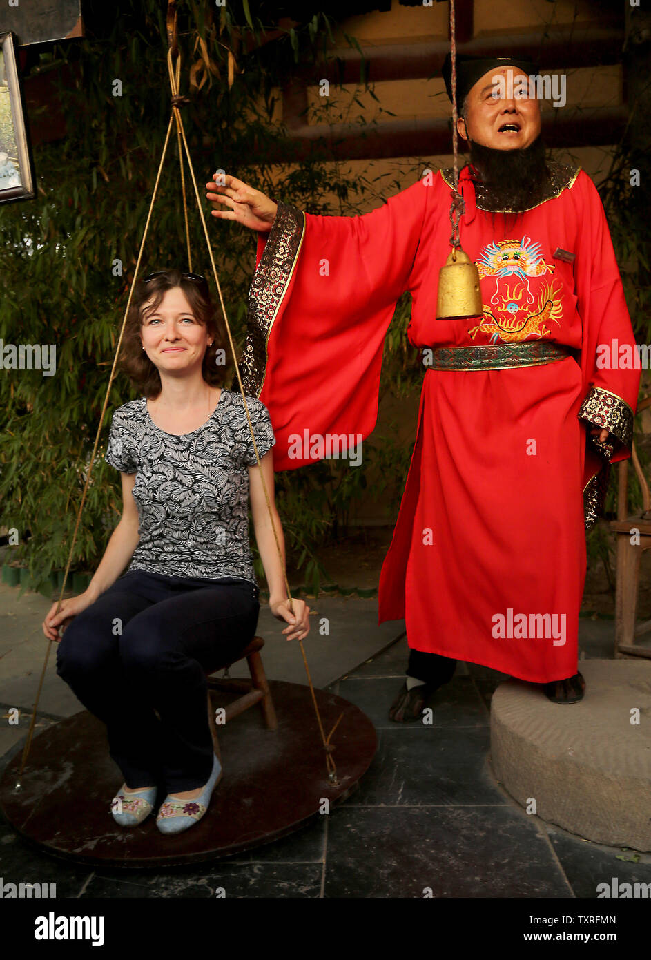 A Russian woman volunteers to have her weight guessed my a traditional ...
