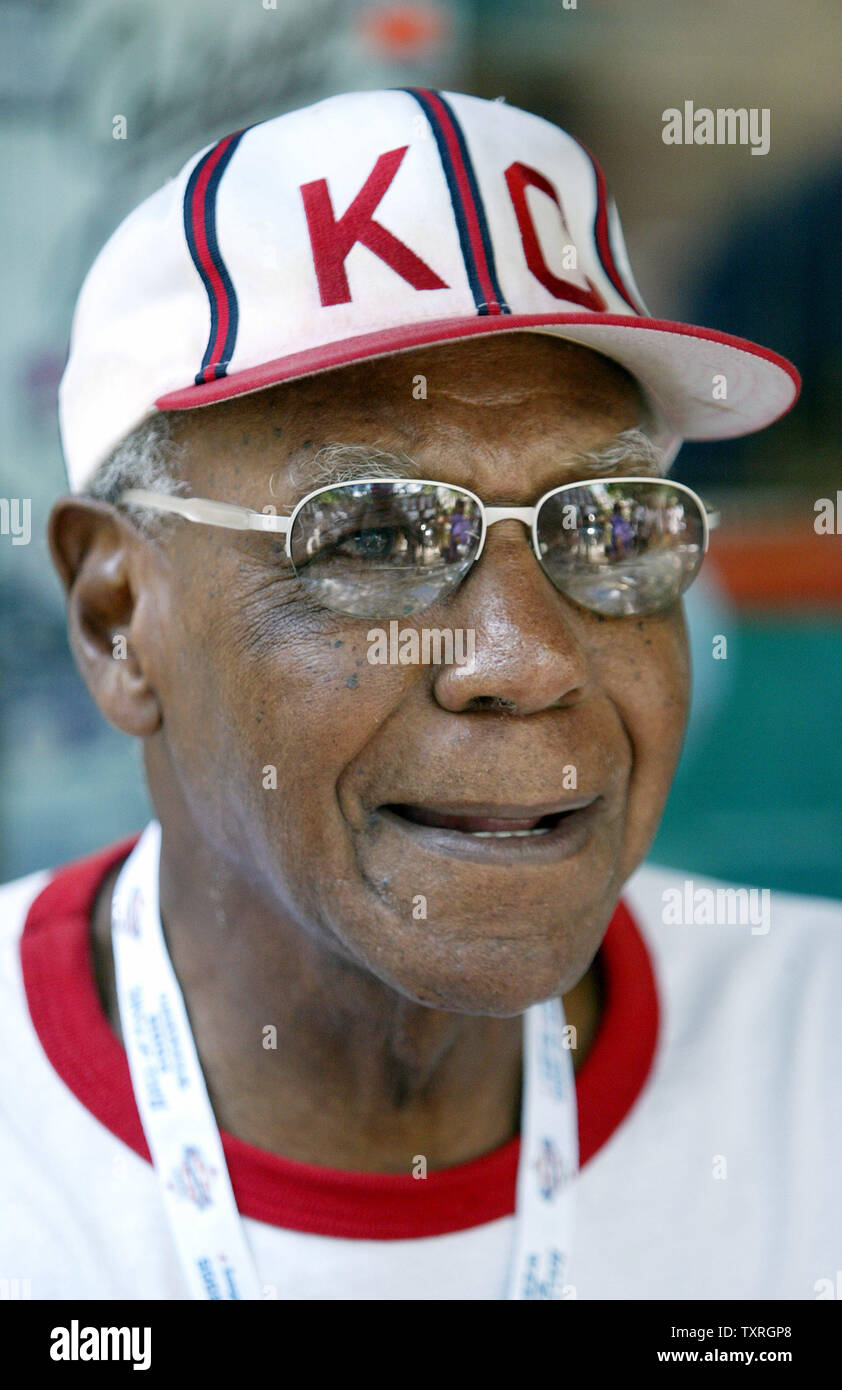 Baseball Hall of Famer Buck O'Neil smiles for fans as they photograph ...