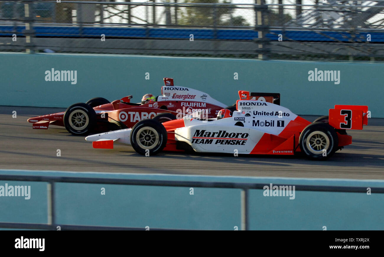 Racer Dan Wheldon of Target Chip Ganassi Racing in car 10 passes Helio ...