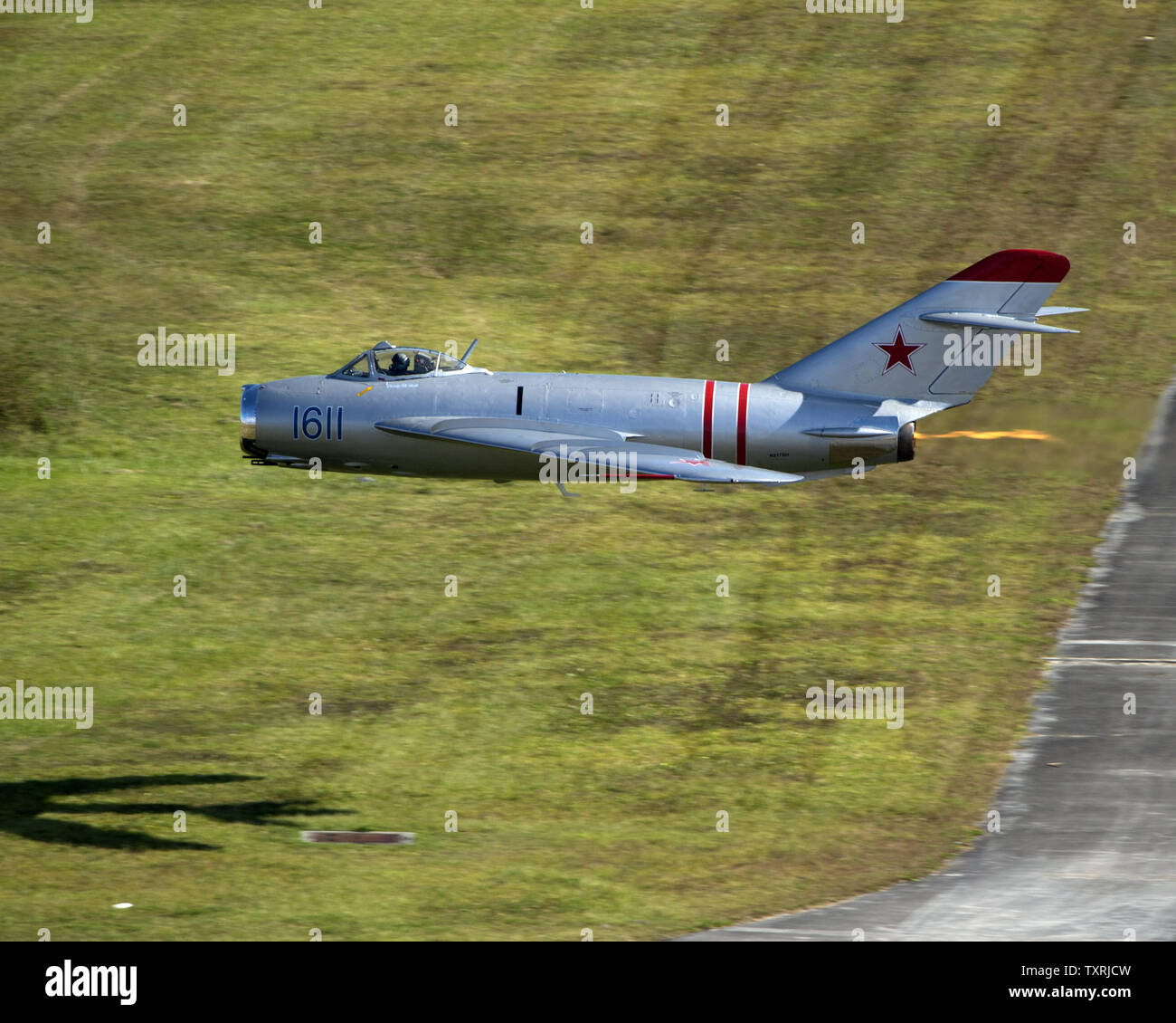 Aerobat Randy Ball performs a low pass in his MiG-17F while performing ...