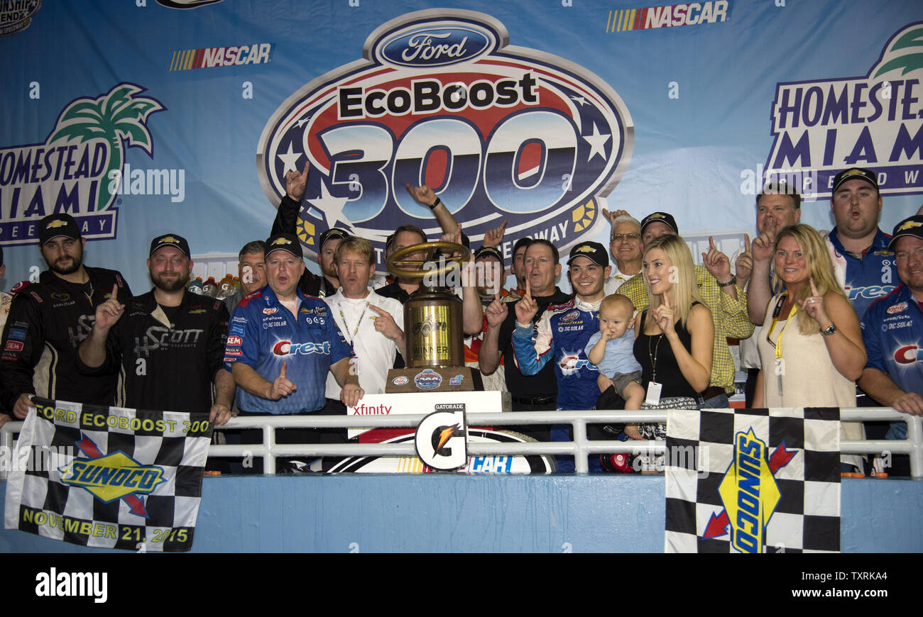 Racer Kyle Larsen, driving for Crest Chevrolet stands at the Winner's ...