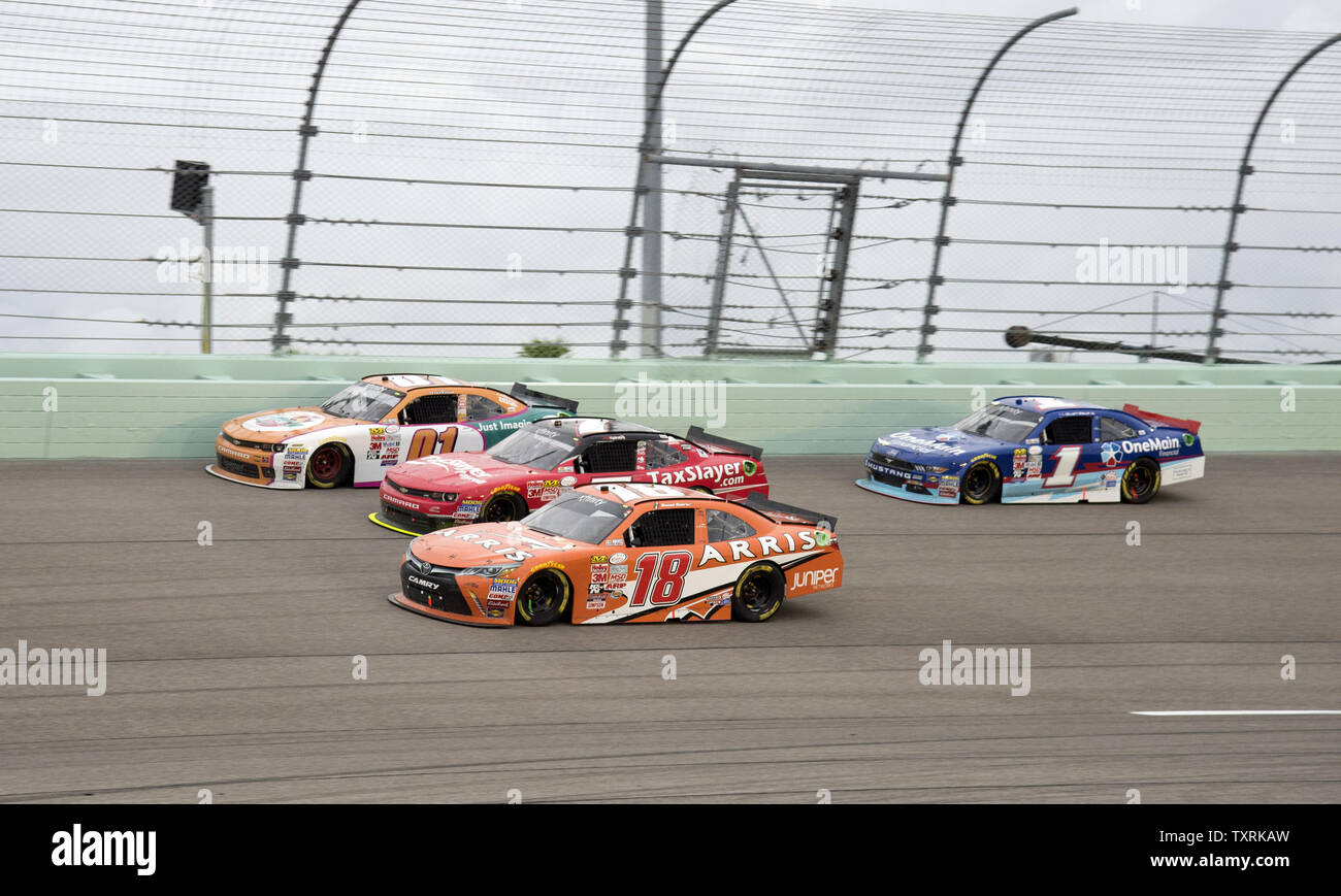 Driver of car #18, Daniel Suarez pulls ahead of other racers at the ...