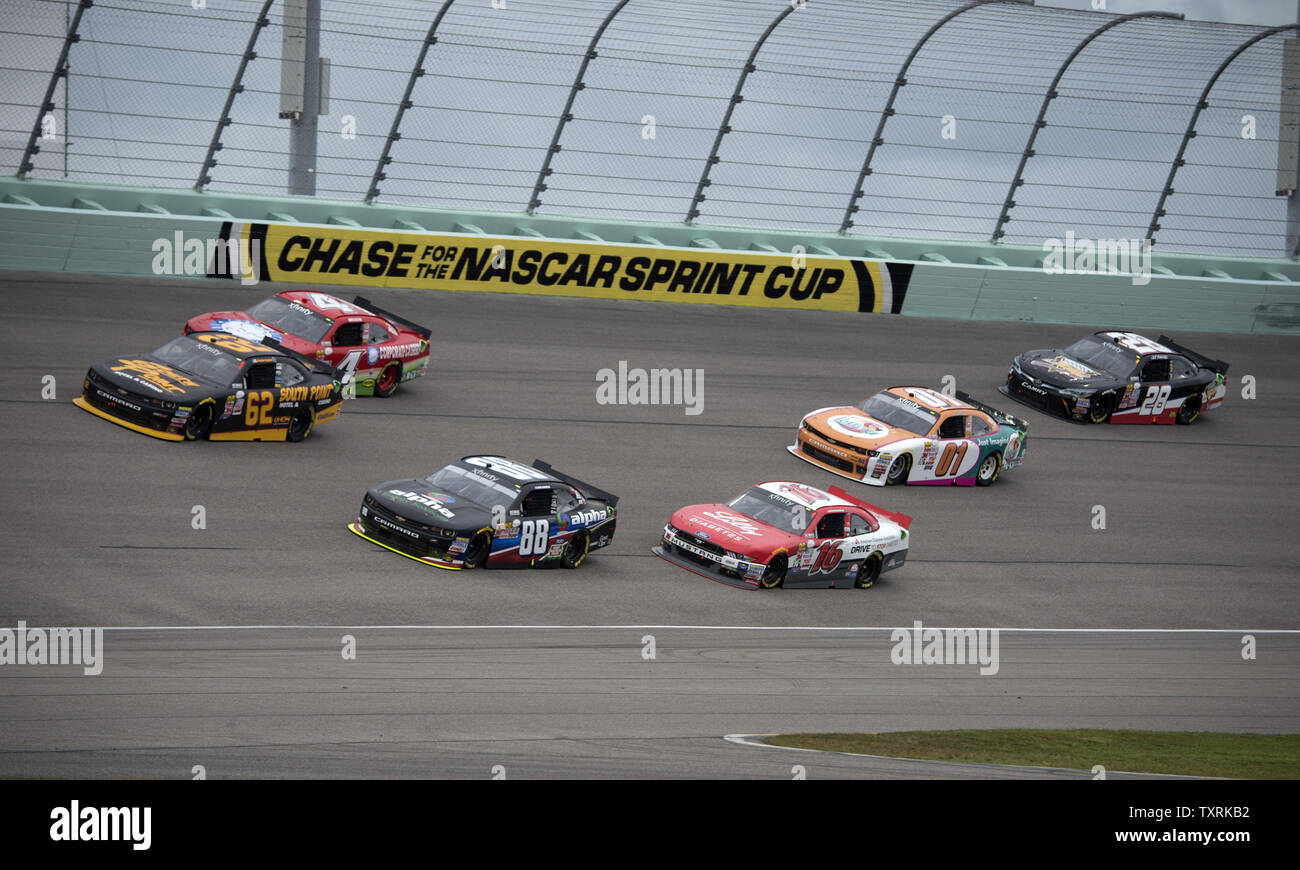 Racer Brendan Gaughan in car # 62 leads a pack of other drivers during ...